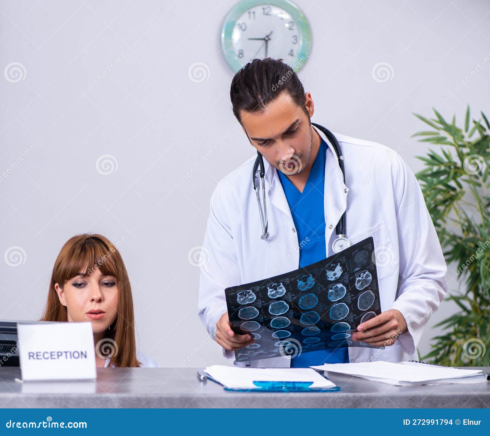 Two Doctors Working at the Reception in the Hospital Stock Photo ...