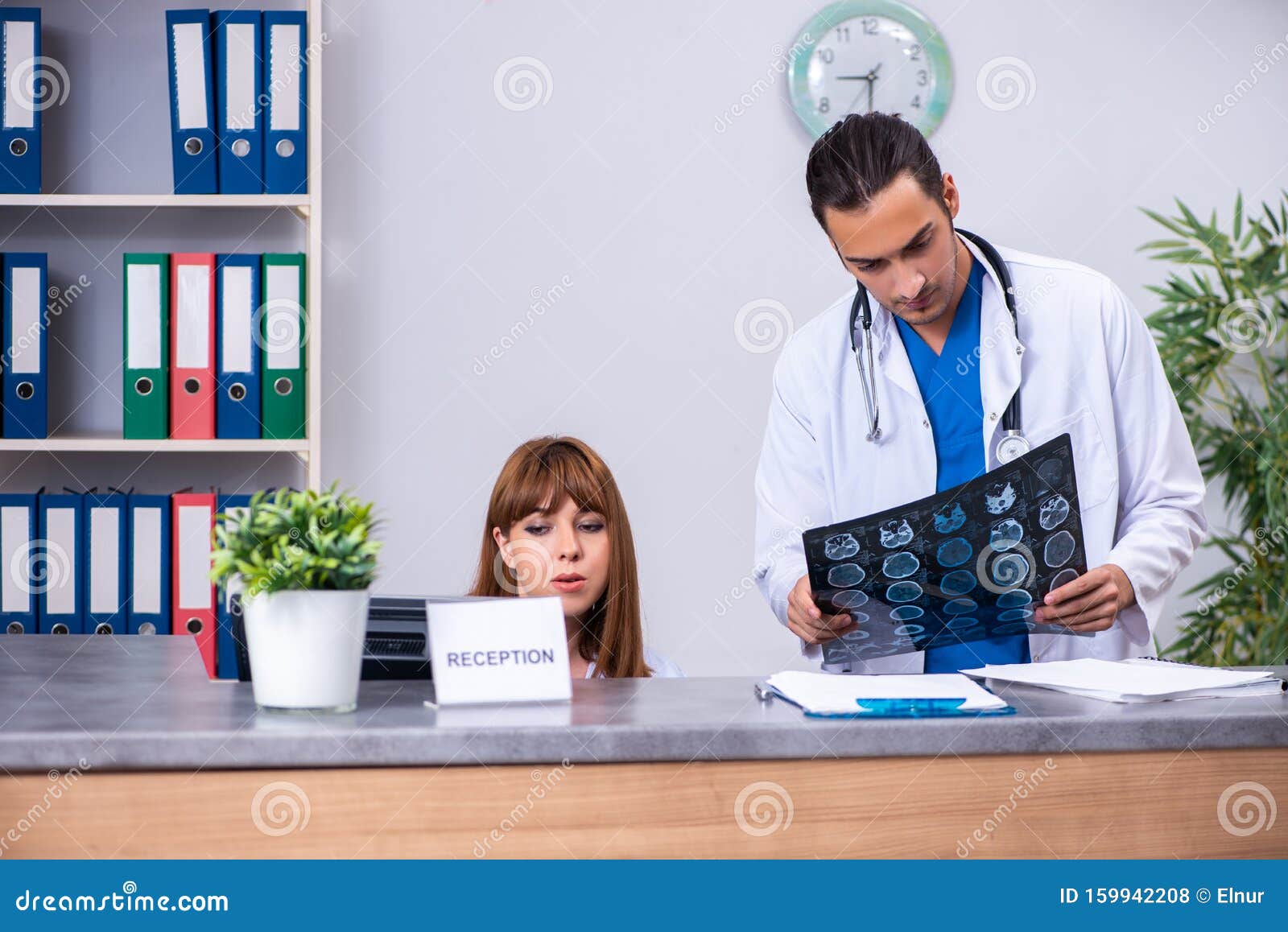 Two Doctors Working at the Reception in the Hospital Stock Photo ...