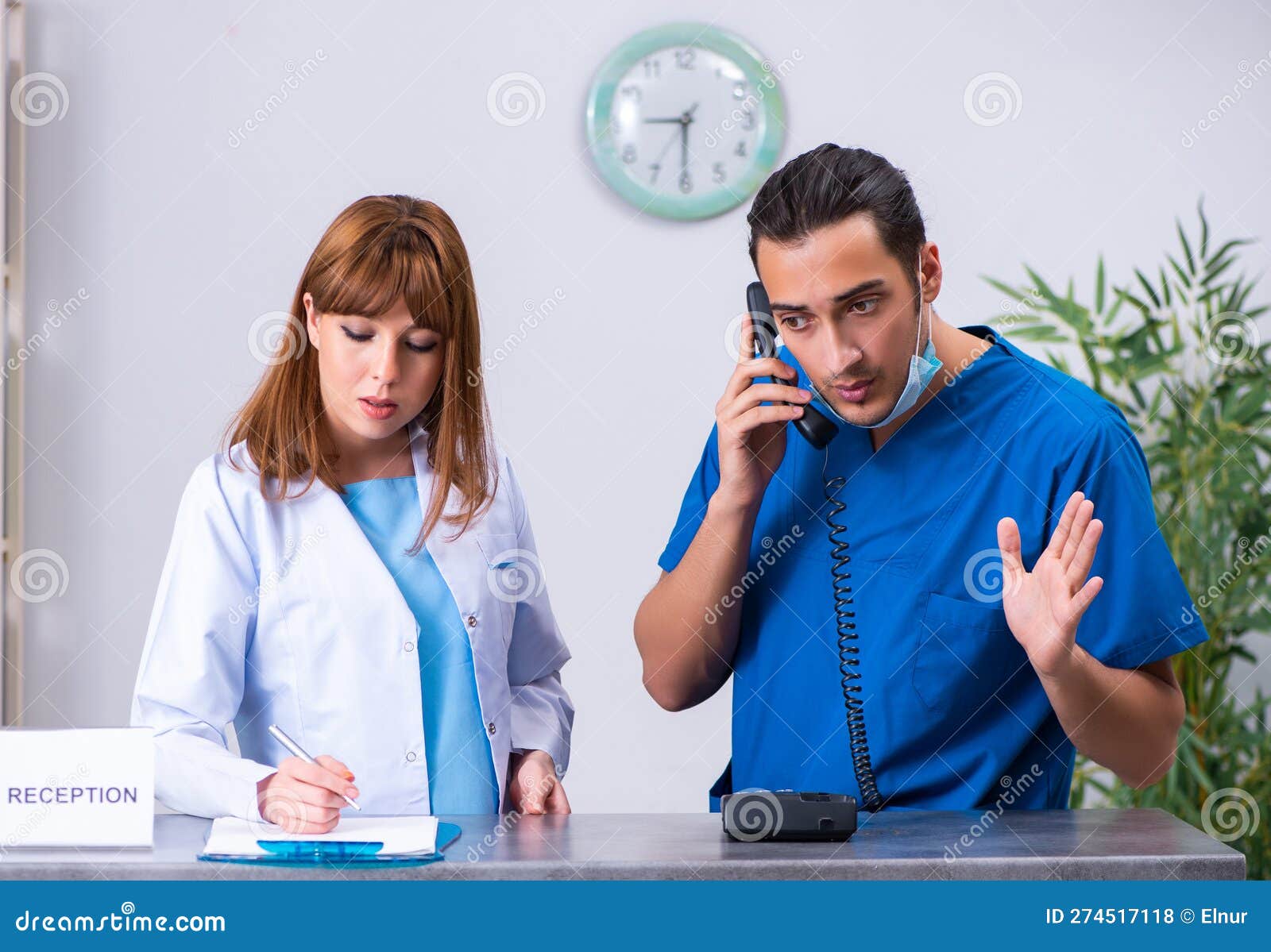 Two Doctors Working at the Reception in the Hospital Stock Photo ...