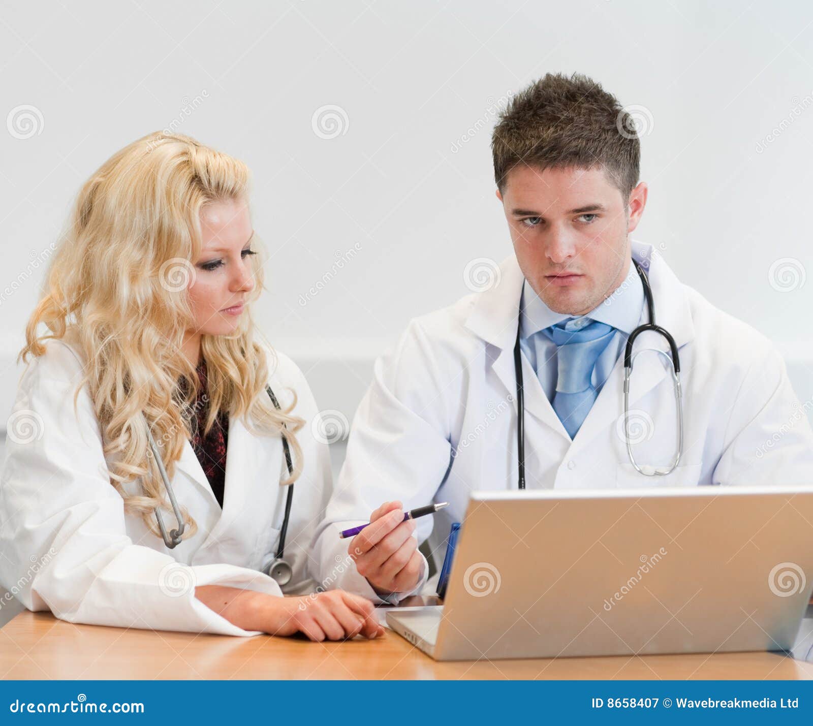Two Doctors Working Together Stock Image - Image of person, friendly ...