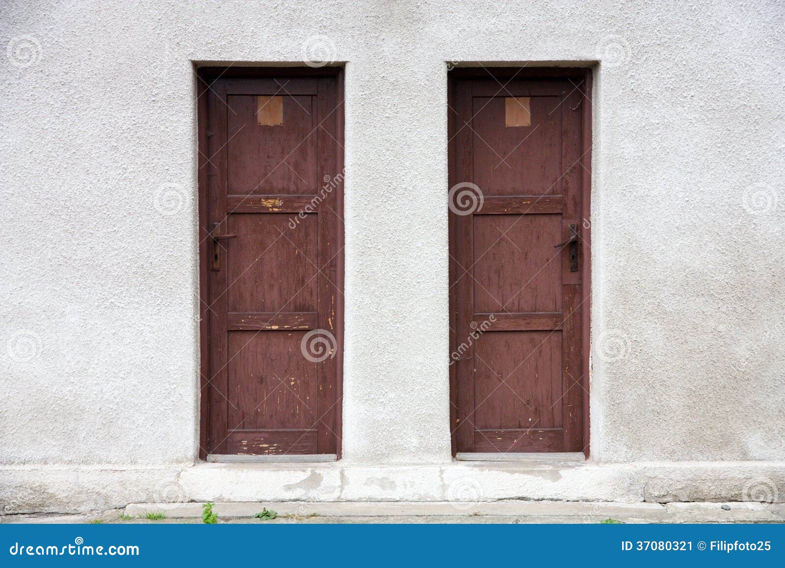 Two doors stock image. Image of stone, wall, locked, doors - 37080321