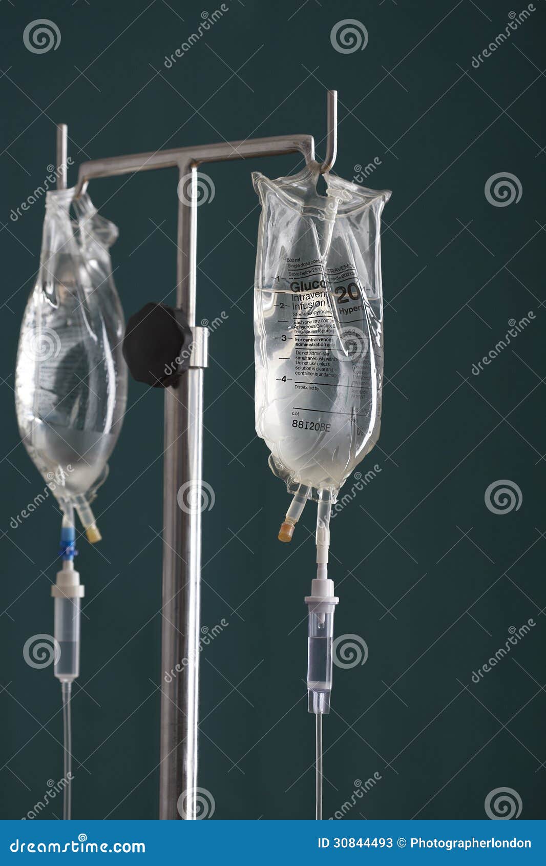 Two Drip Bags on Stand Against Black Background Stock Image - Image of ...