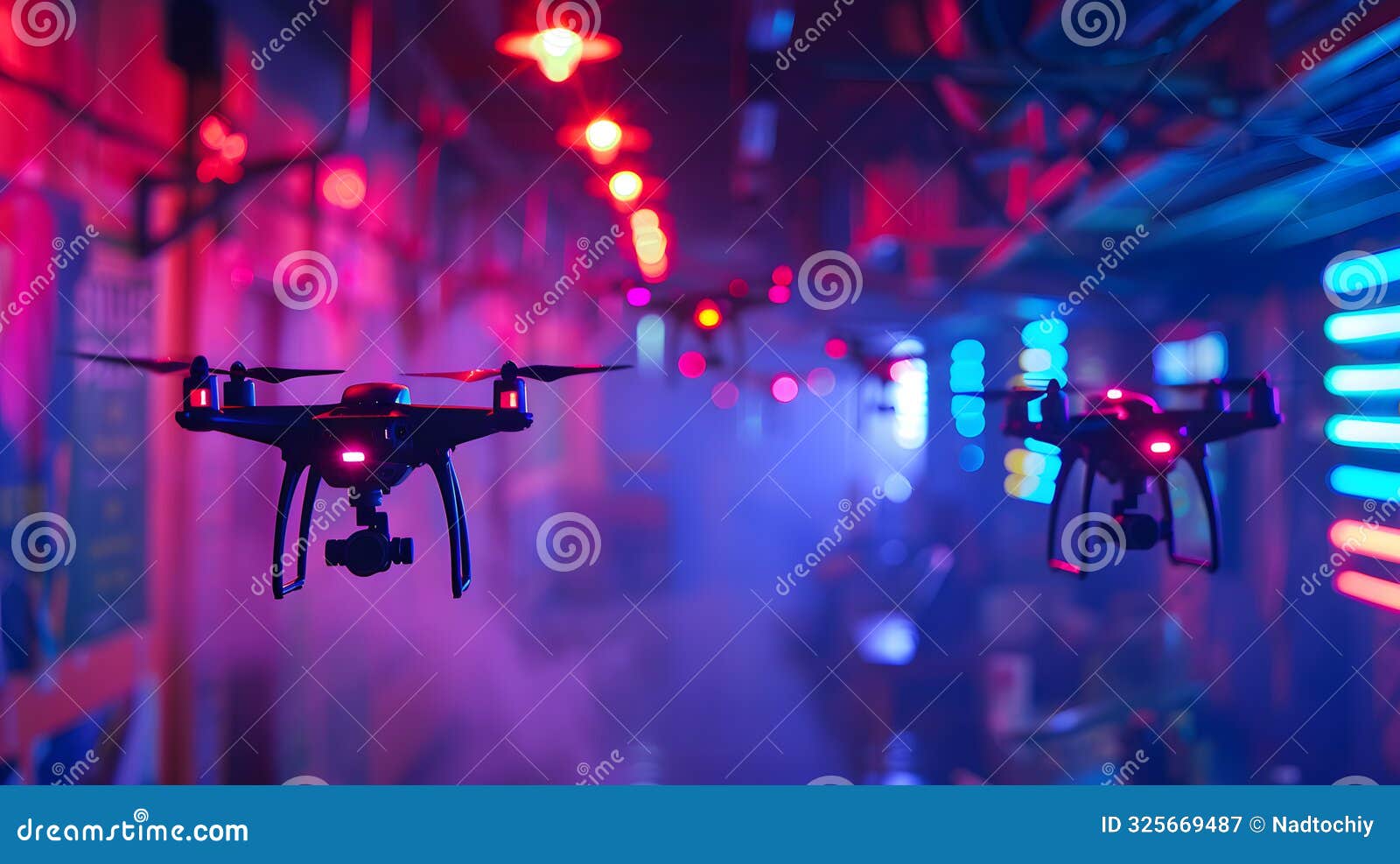 Two Drones Creating Visual Effect Lighting in a Dark Music Venue Stock ...