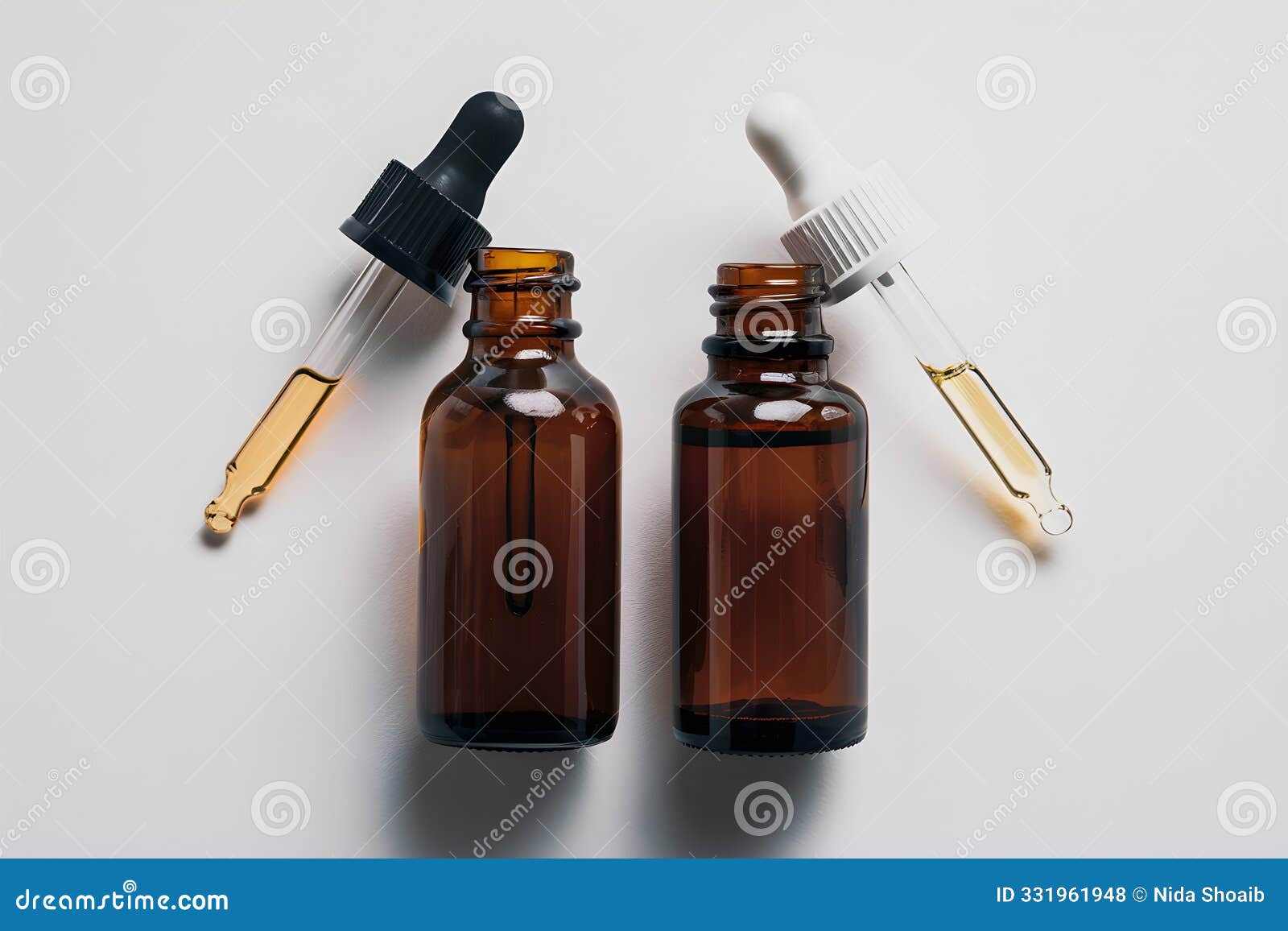 Two Dropper Bottles Amber and Clear Side by Side on White Background ...