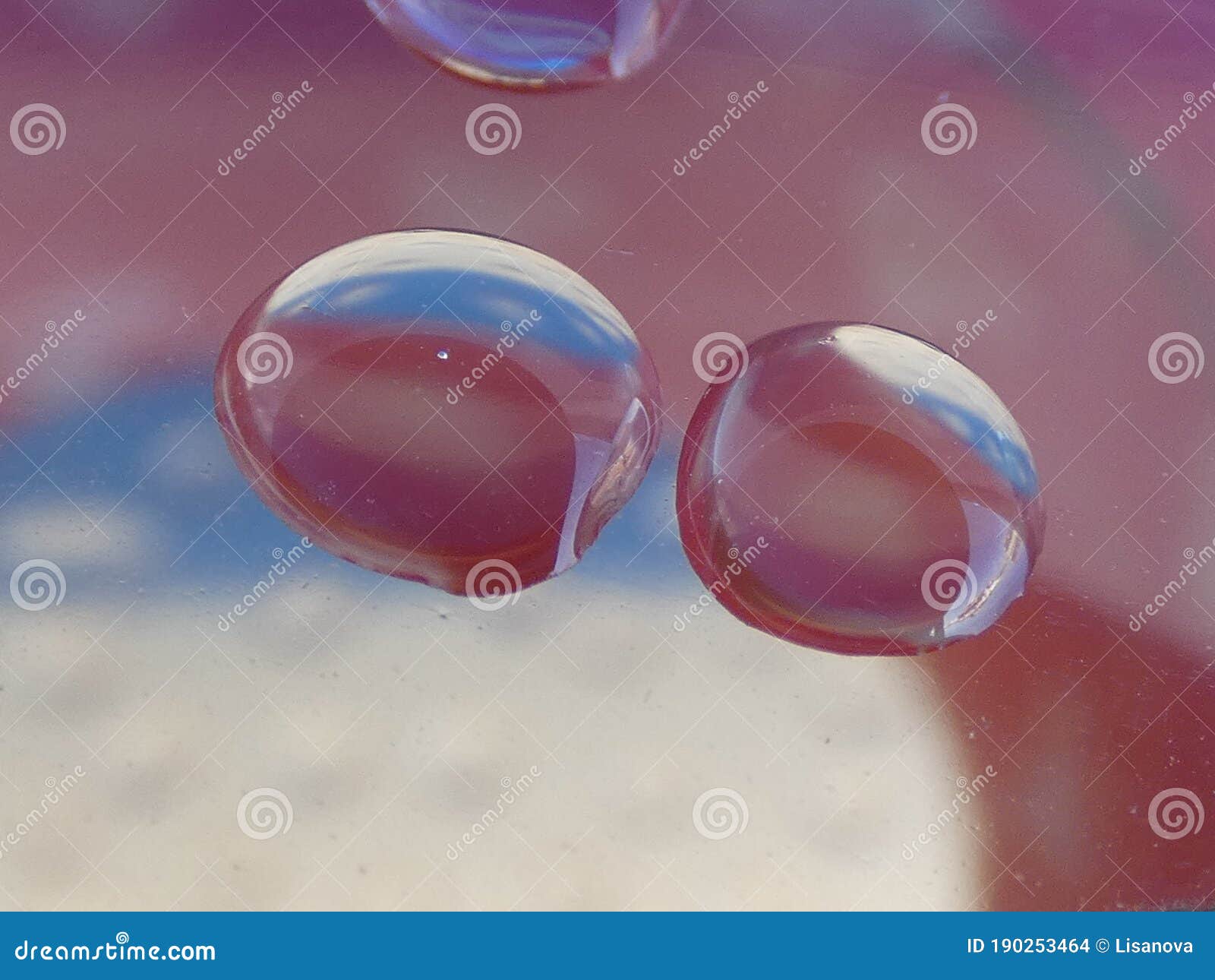 Two Drops of Water on a Colored Surface Stock Photo - Image of colored ...