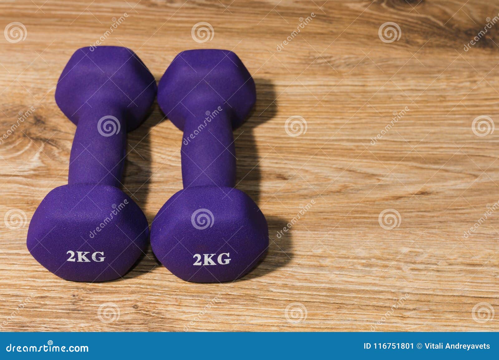 Two Dumbbells of 2 Kilograms on a Wooden Background Stock Image - Image ...