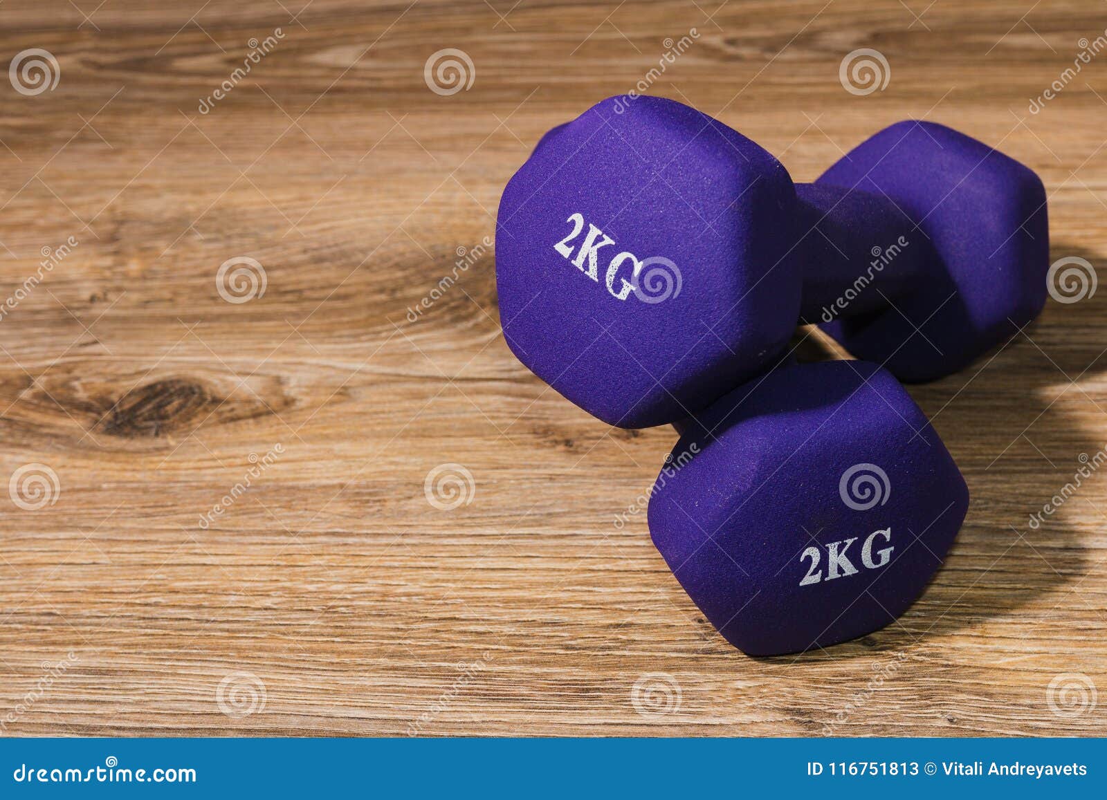 Two Dumbbells of 2 Kilograms on a Wooden Background Stock Image - Image ...