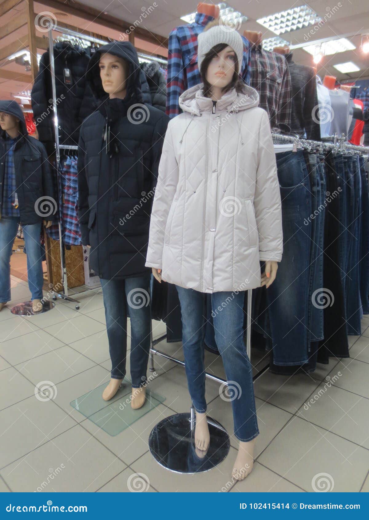 Two Dummy Men and Women in Jackets and Jeans in the Store. Stock Photo ...