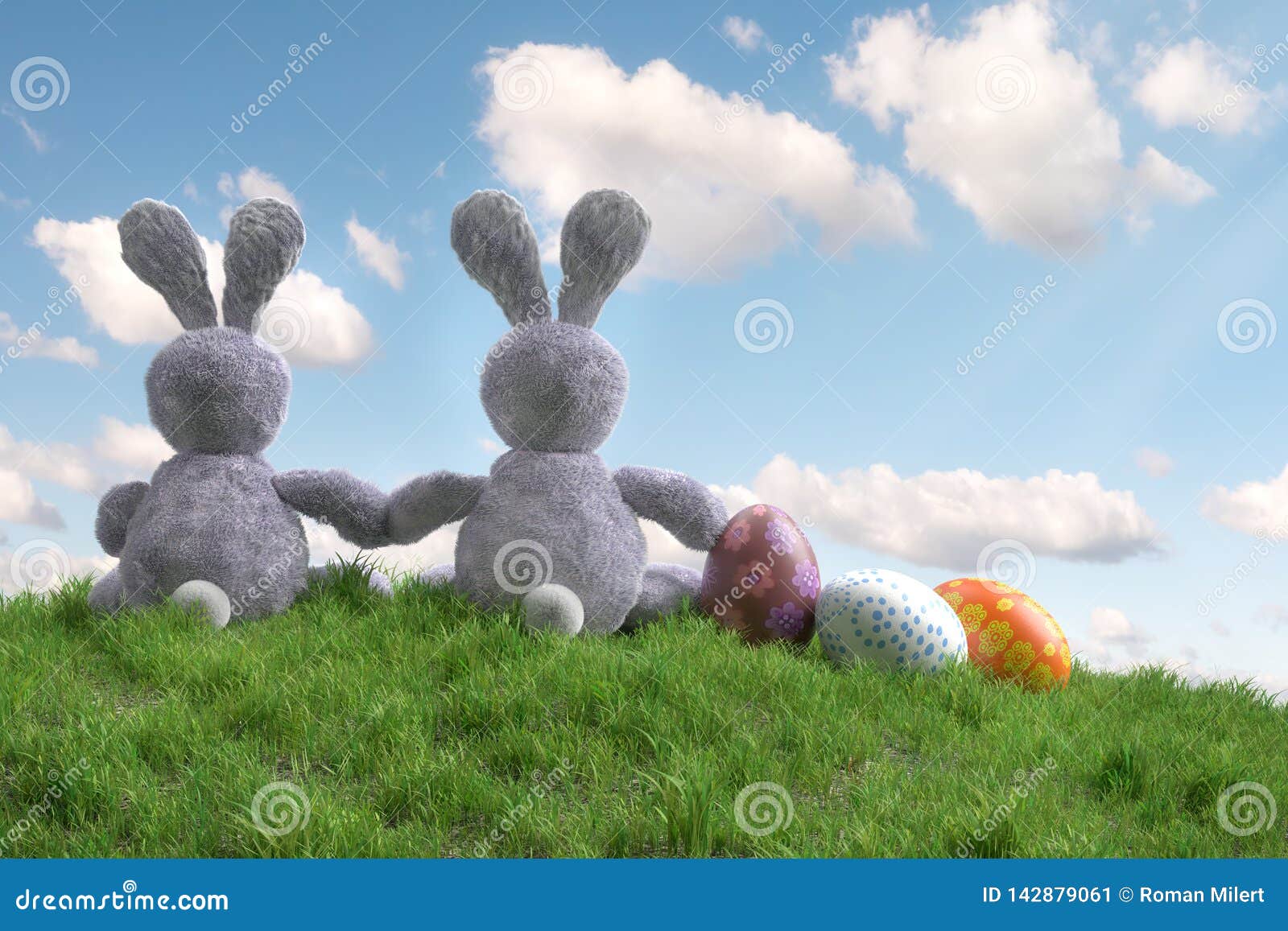 Two Easter Bunnies Sitting in the Grass with Easter Eggs Stock ...