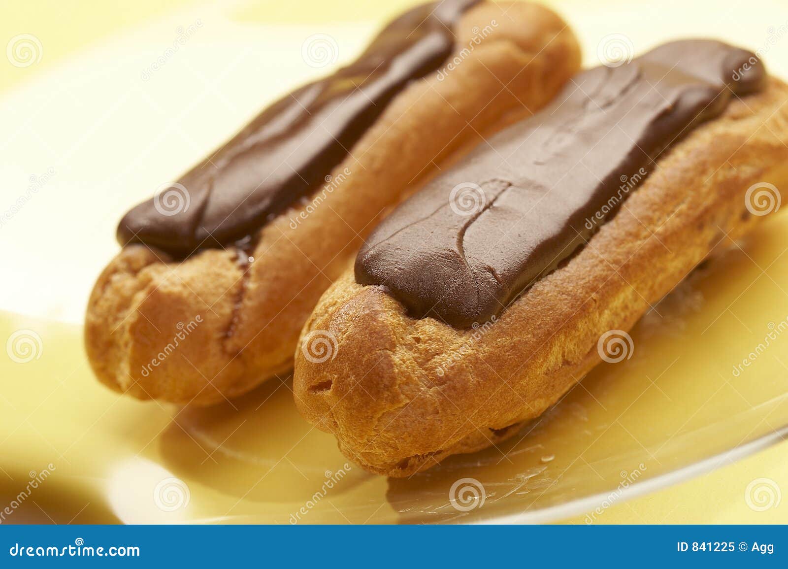 Two eclair stock image. Image of plate, custard, cake, sweetmeats - 841225