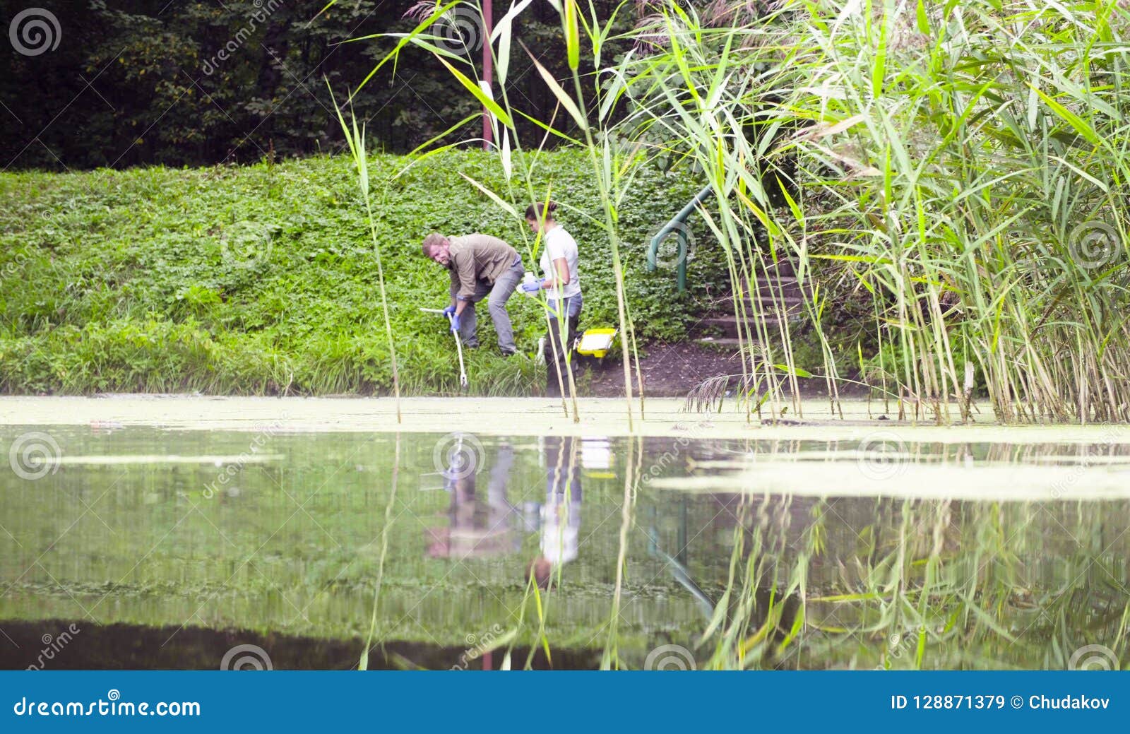 Two Ecologist Getting Soil Samples from the Bottom of the Lake Stock ...