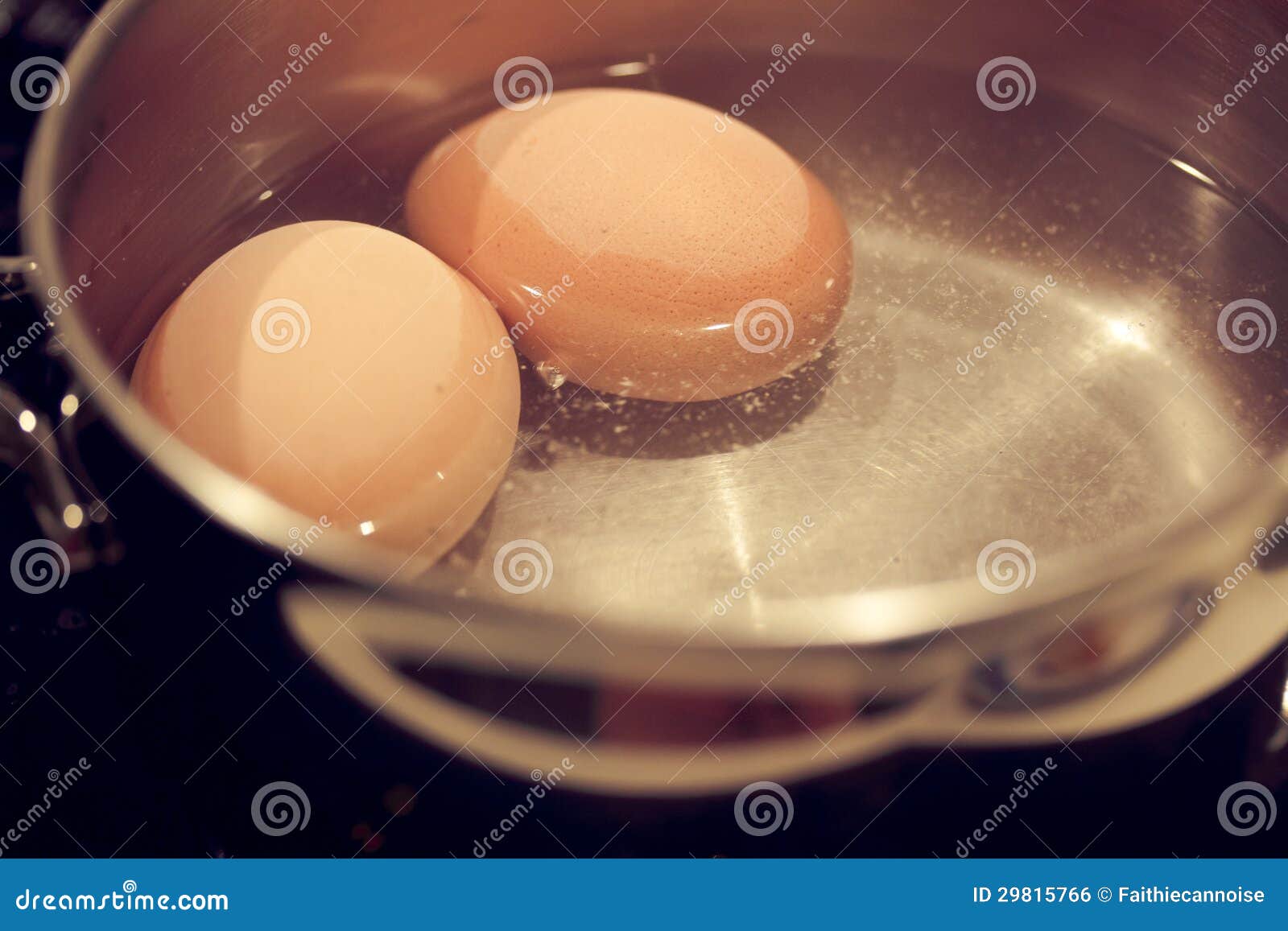 A couple of eggs boiling stock photo. Image of recipe - 29815766