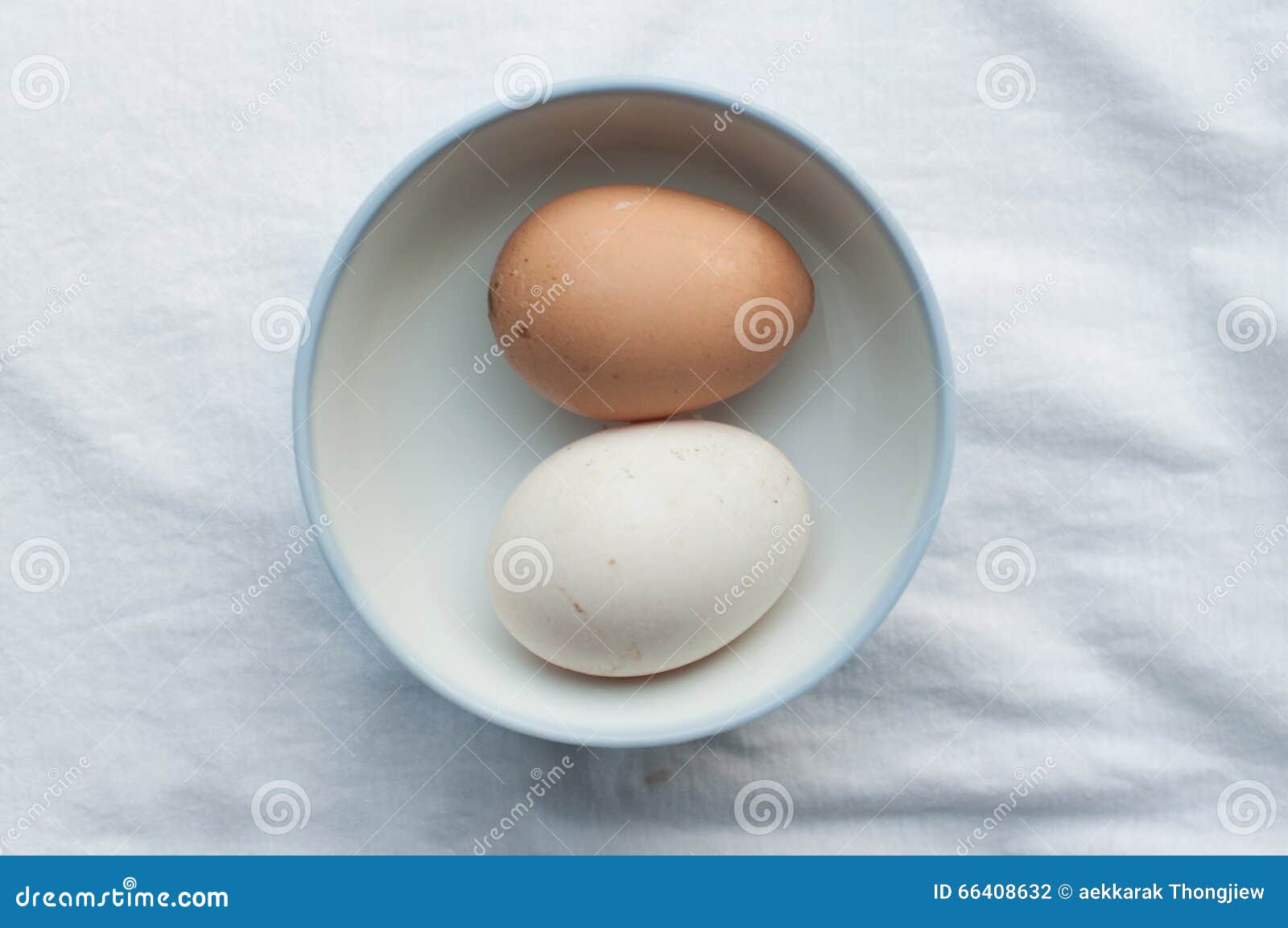 Two Eggs in Cup on Fabric Background Stock Photo - Image of alone ...