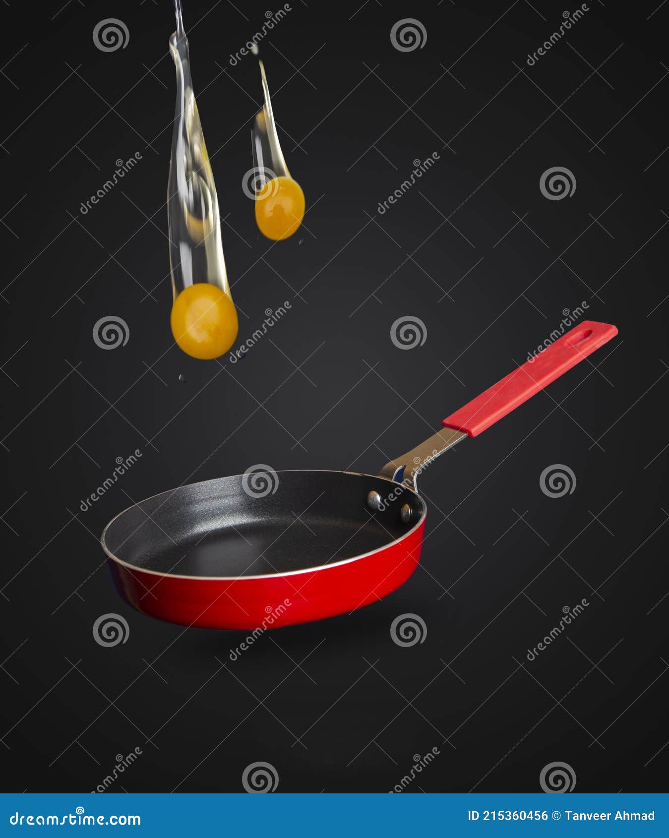Two Eggs Falling into the Pan - Breakfast Cooking Concept Stock Photo ...