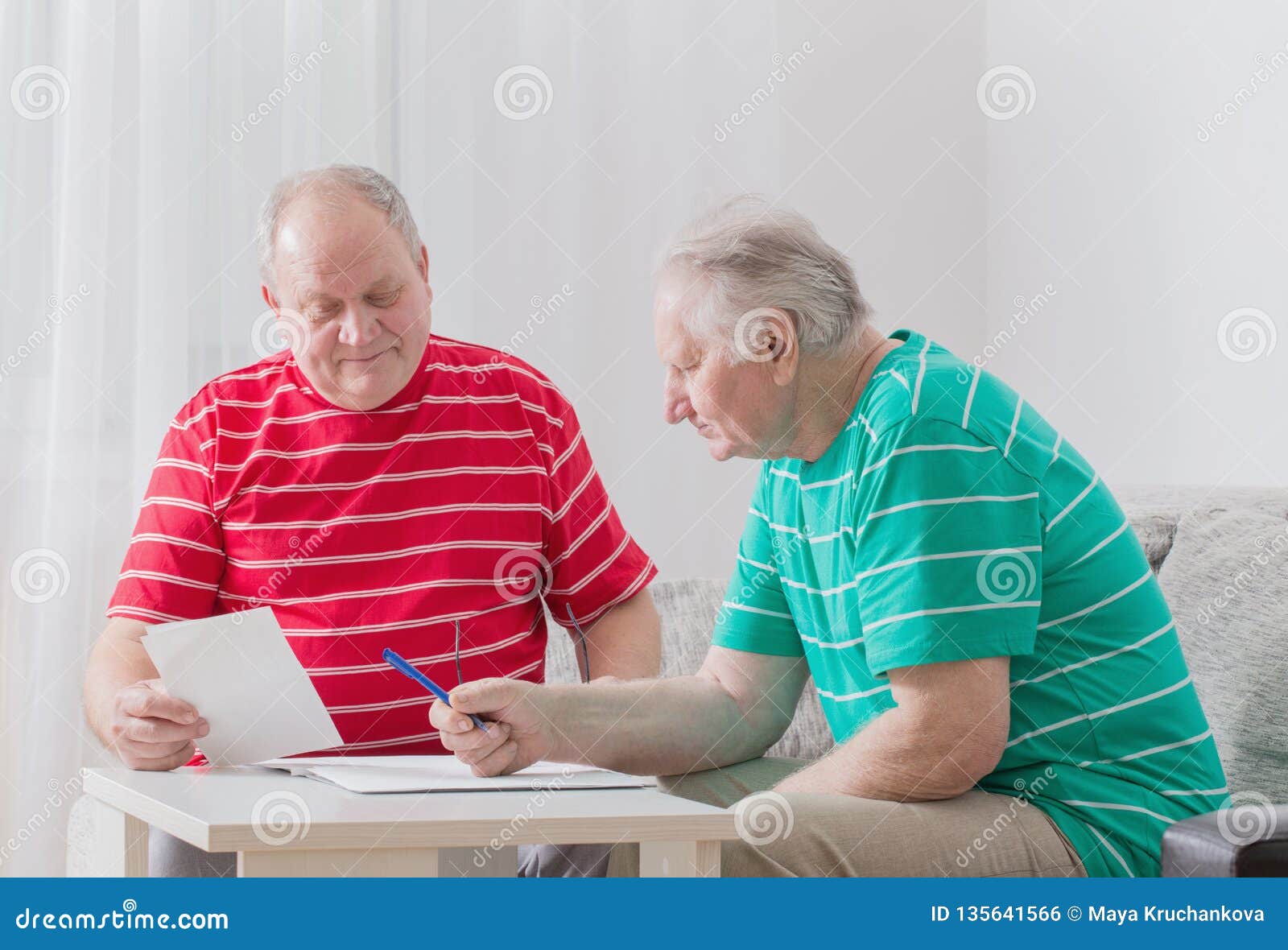 Elderly men with documents stock photo. Image of male - 135641566