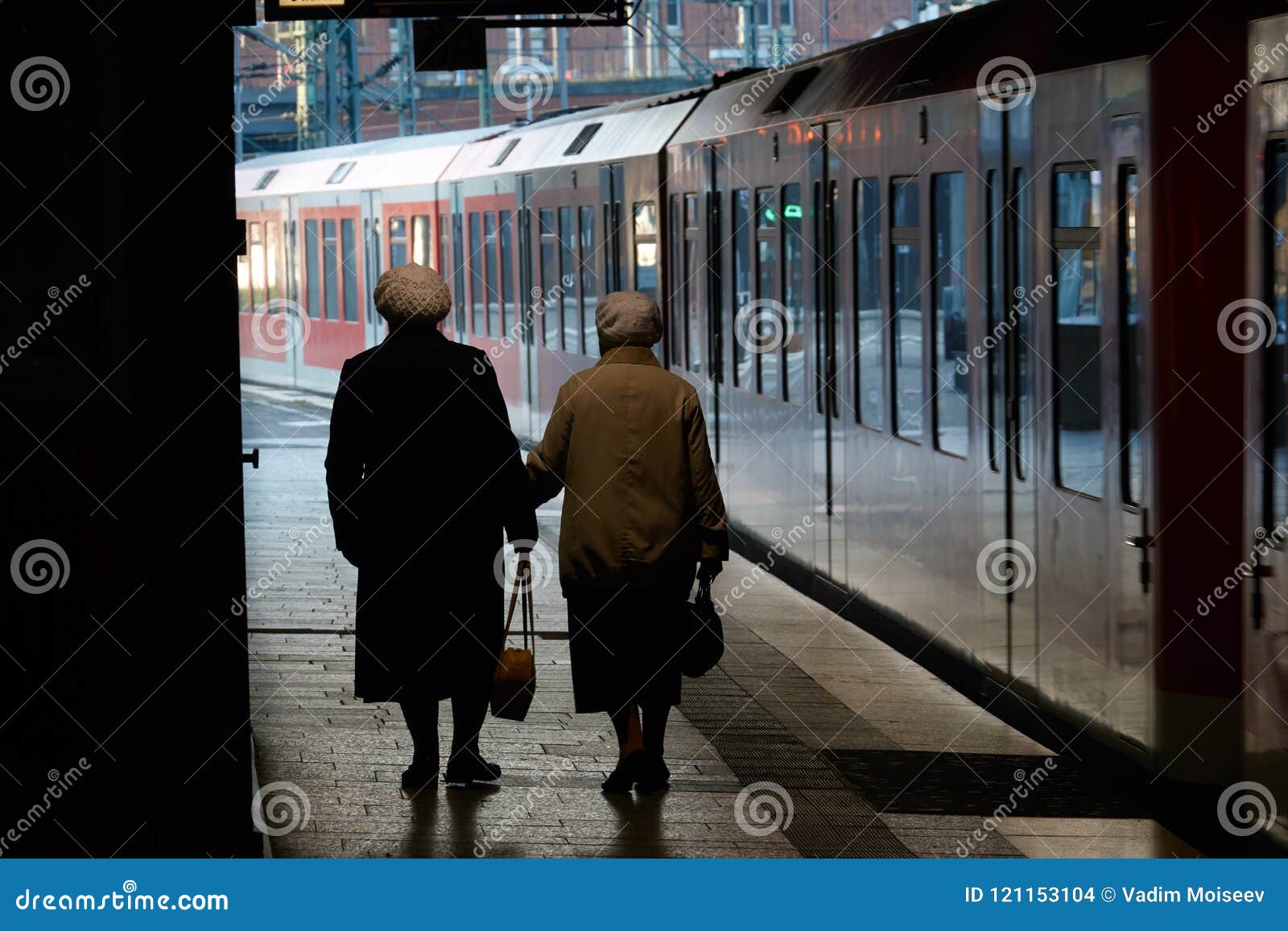 Two Elderly Women Attend the Train Station Along the Train. View from ...