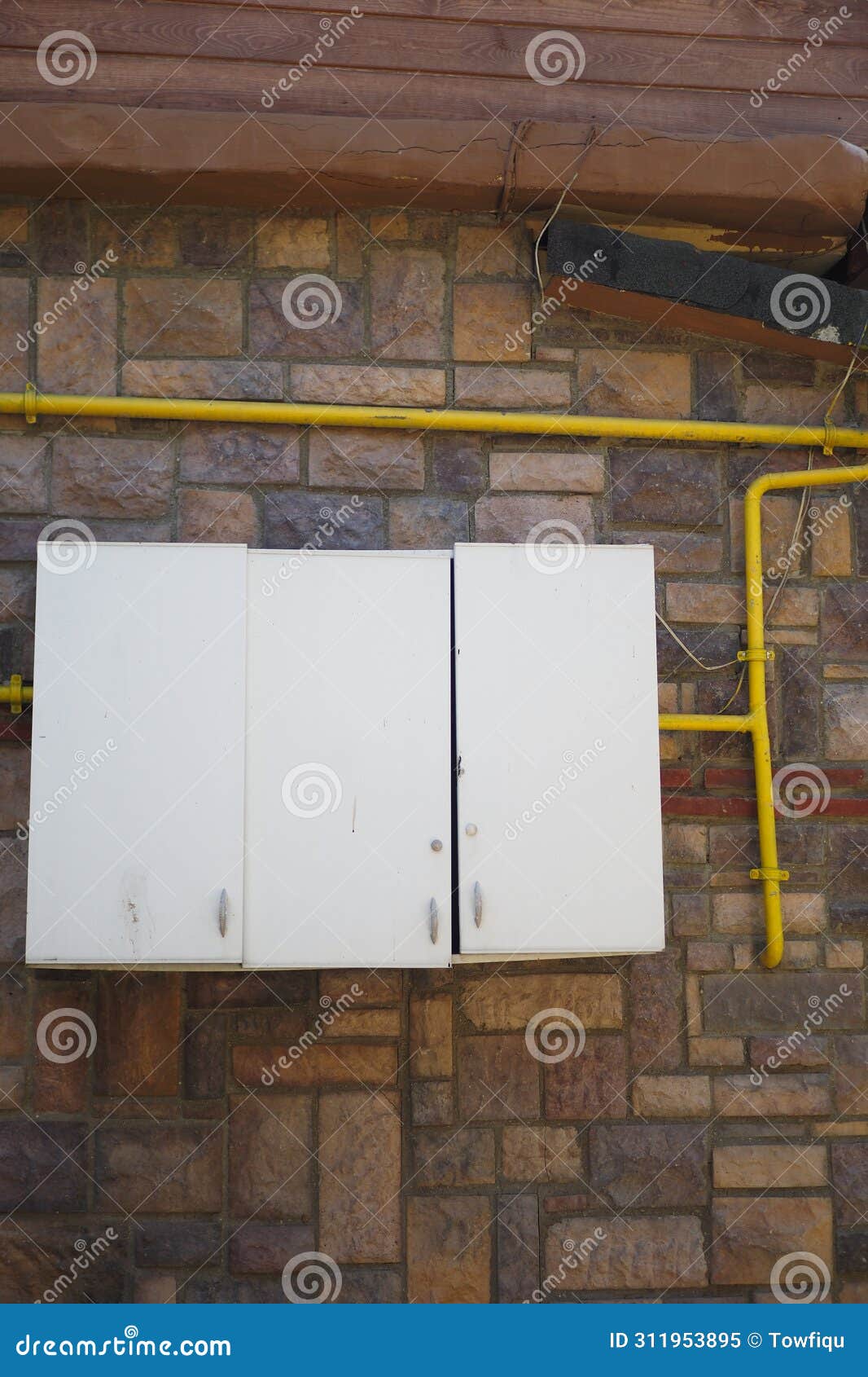 Two Electrical Boxes with Lightning Bolt on Brick Wall Stock Image ...
