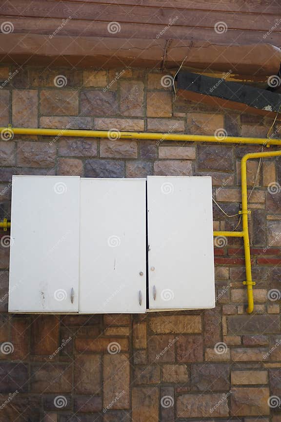 Two Electrical Boxes with Lightning Bolt on Brick Wall Stock Image ...