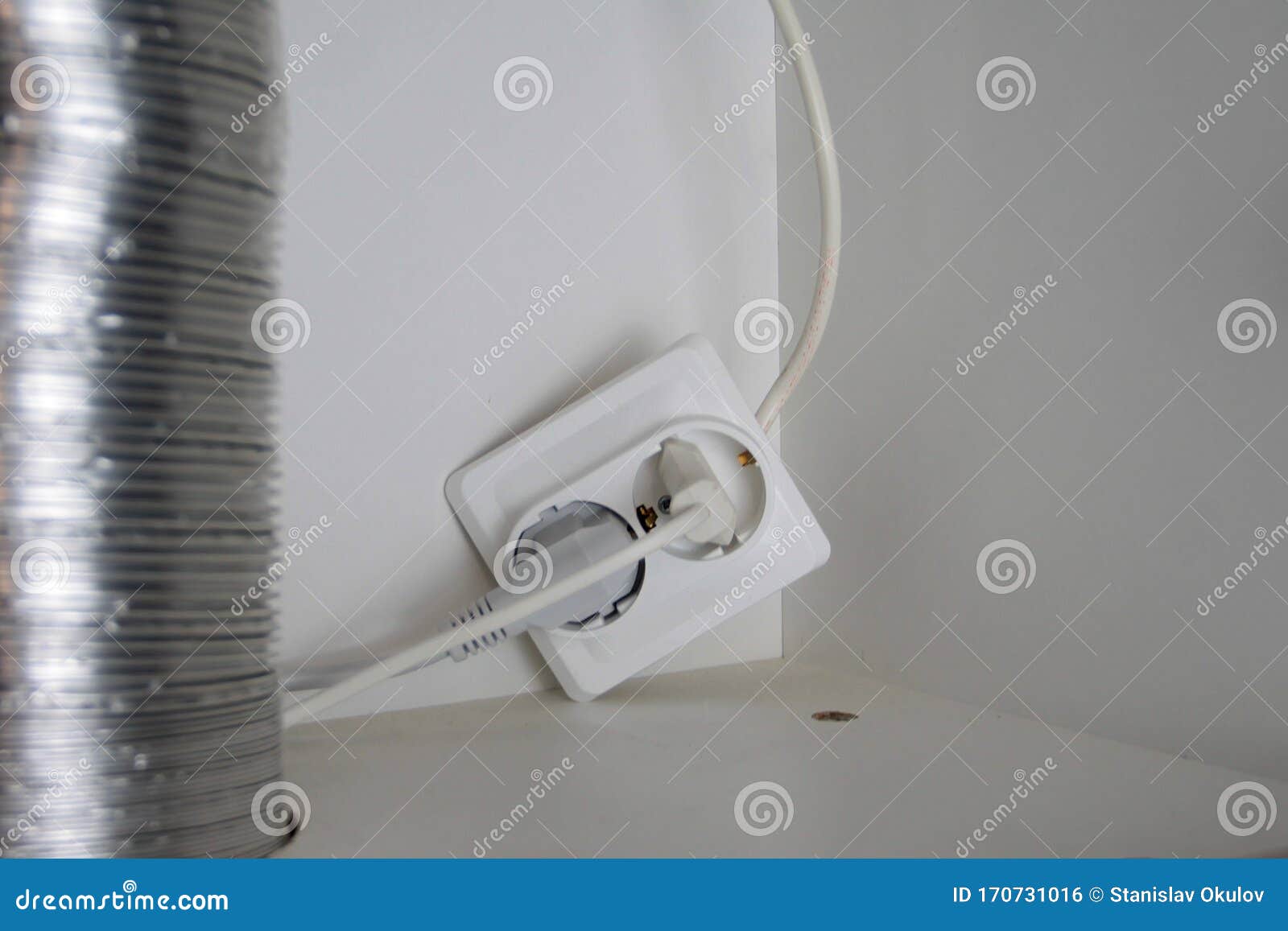 Two Electrical Plugs are Plugged into a Broken Outlet Stock Photo ...