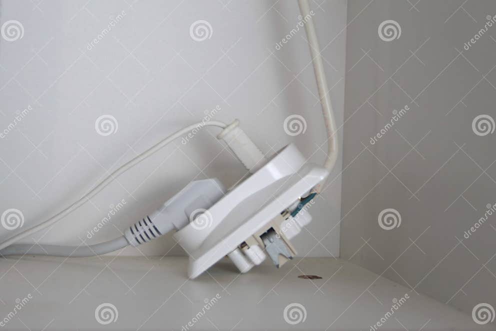 Two Electrical Plugs are Plugged into a Broken Outlet Stock Photo ...