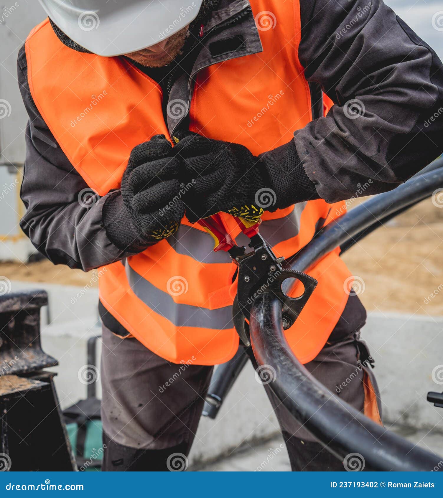 Two Electrician Builder Workers Installing High-voltage Cable Stock ...