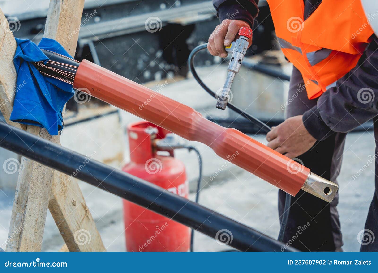 Two Electrician Builder Workers Installing High-voltage Cable Stock ...