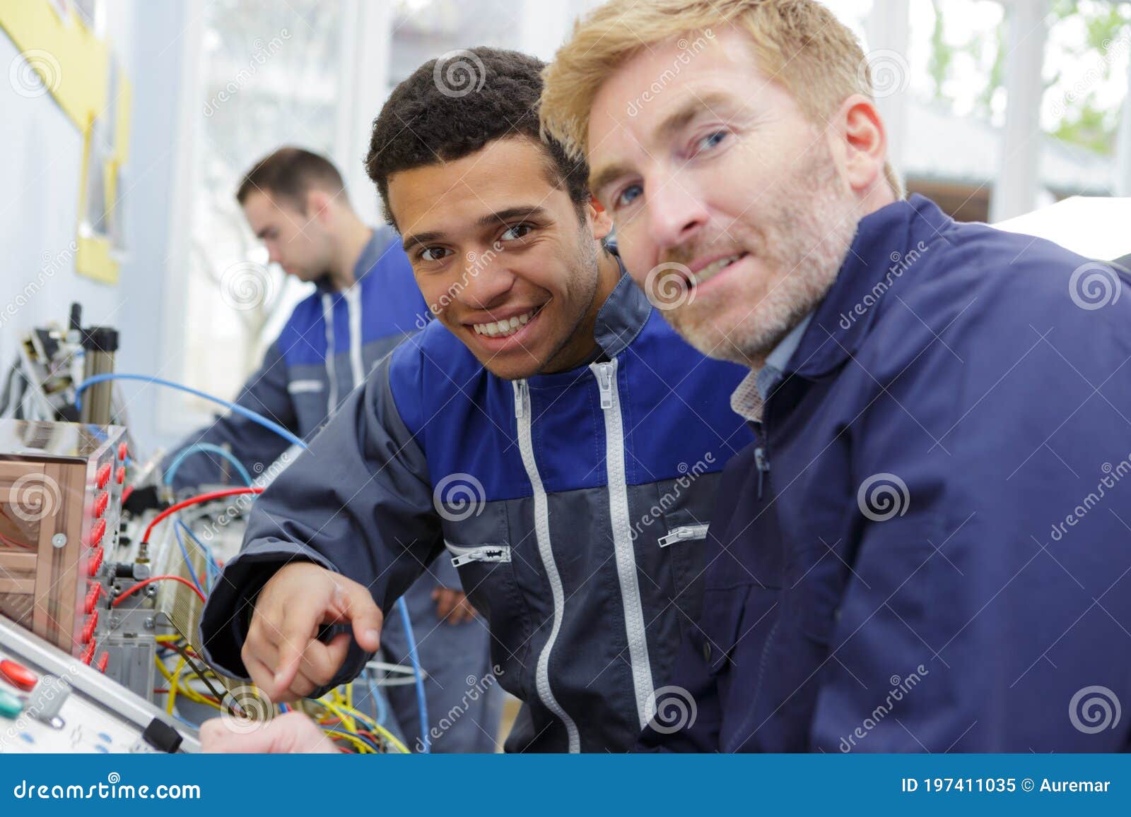 Two Electrician Workers at Wiring Cable and Light Switch Stock Image ...