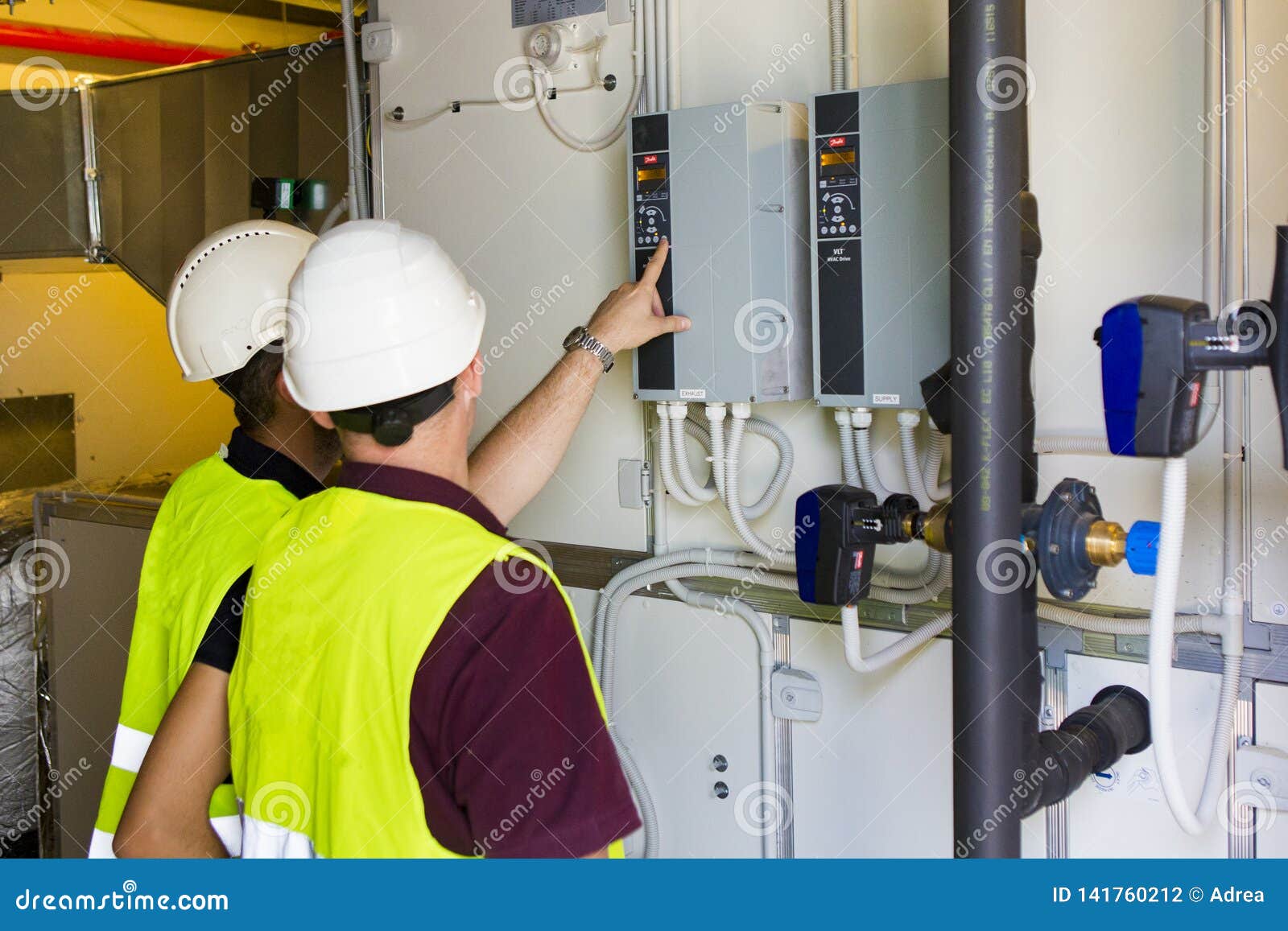 Two Electricians Checking the Power Panel Stock Photo - Image of ...