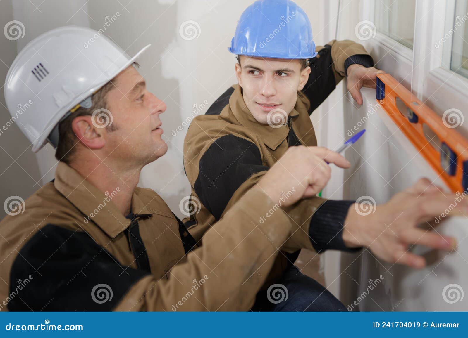 Two Electricians with Level Stock Image - Image of contractor, workwear ...