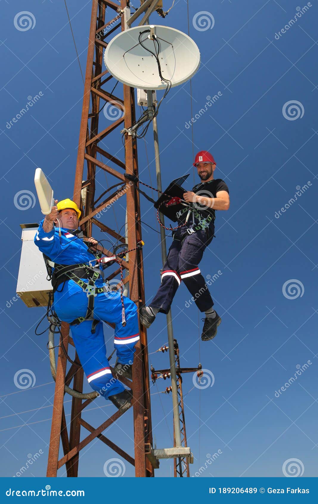 Two Electricians in Protective Workwear Install Telecommunications ...