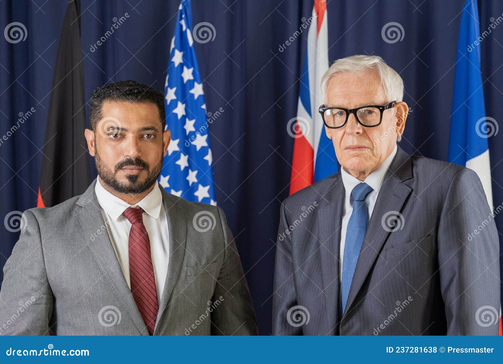 Two Elegant Male Delegates from Various Countries Standing Against ...