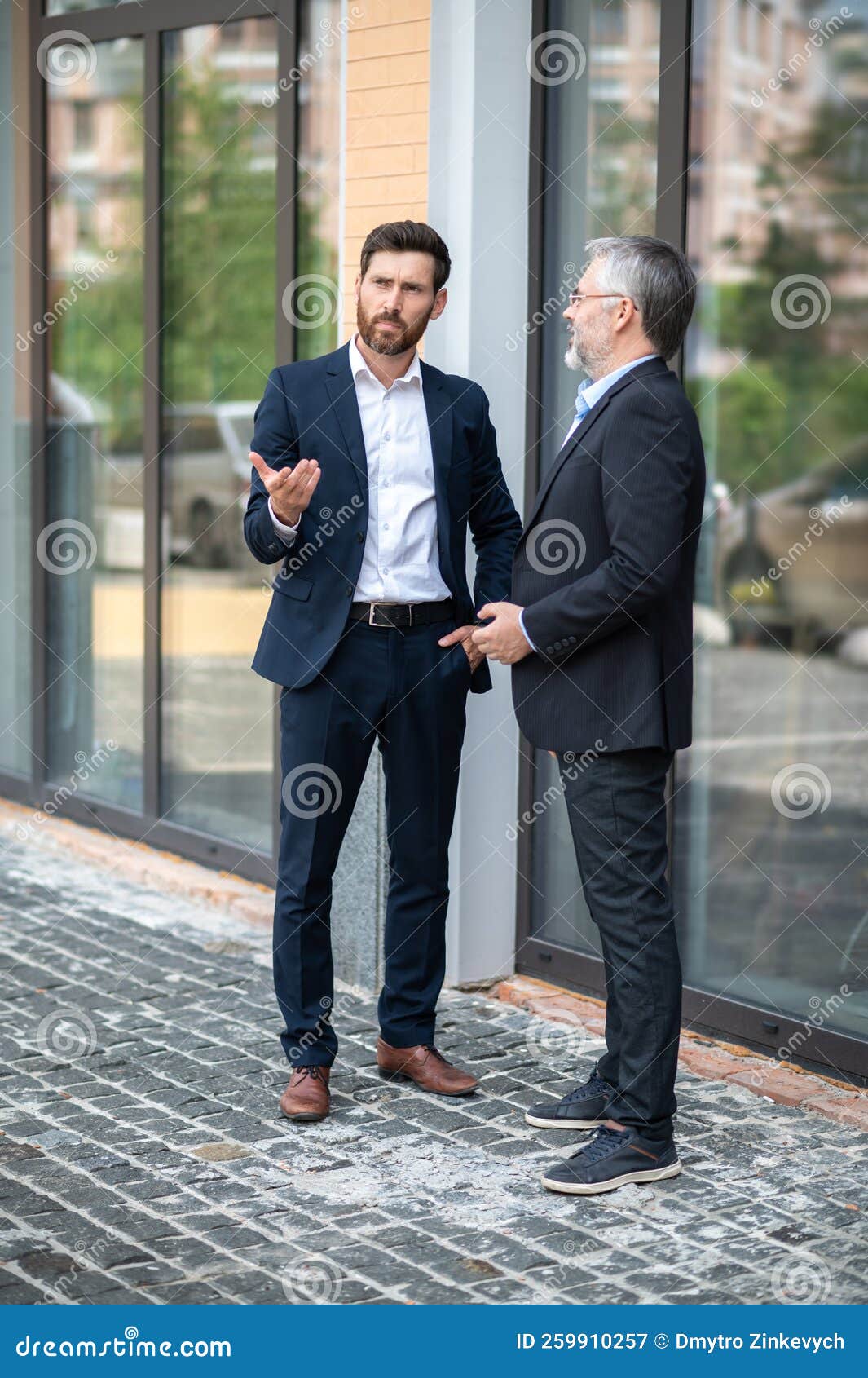 Two Elegant Men Talking and Looking Interested Stock Image - Image of ...