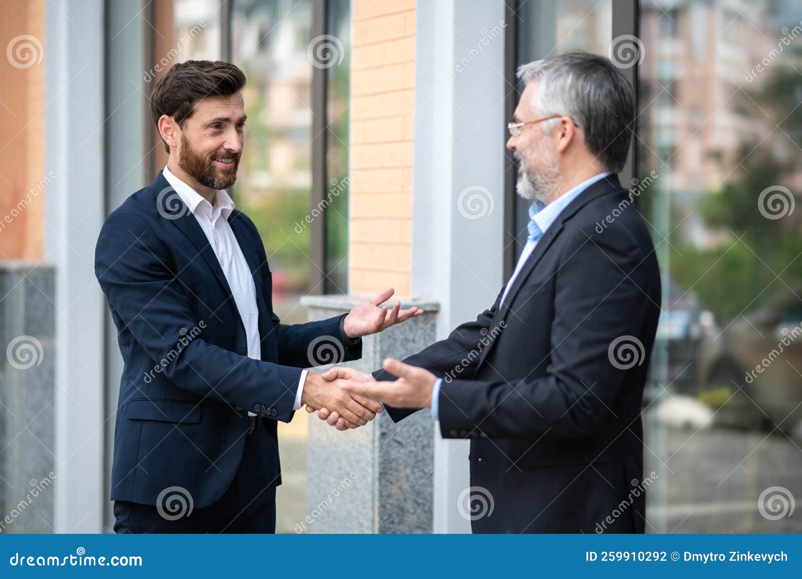 Two Elegant Men Talking and Looking Interested Stock Photo - Image of ...