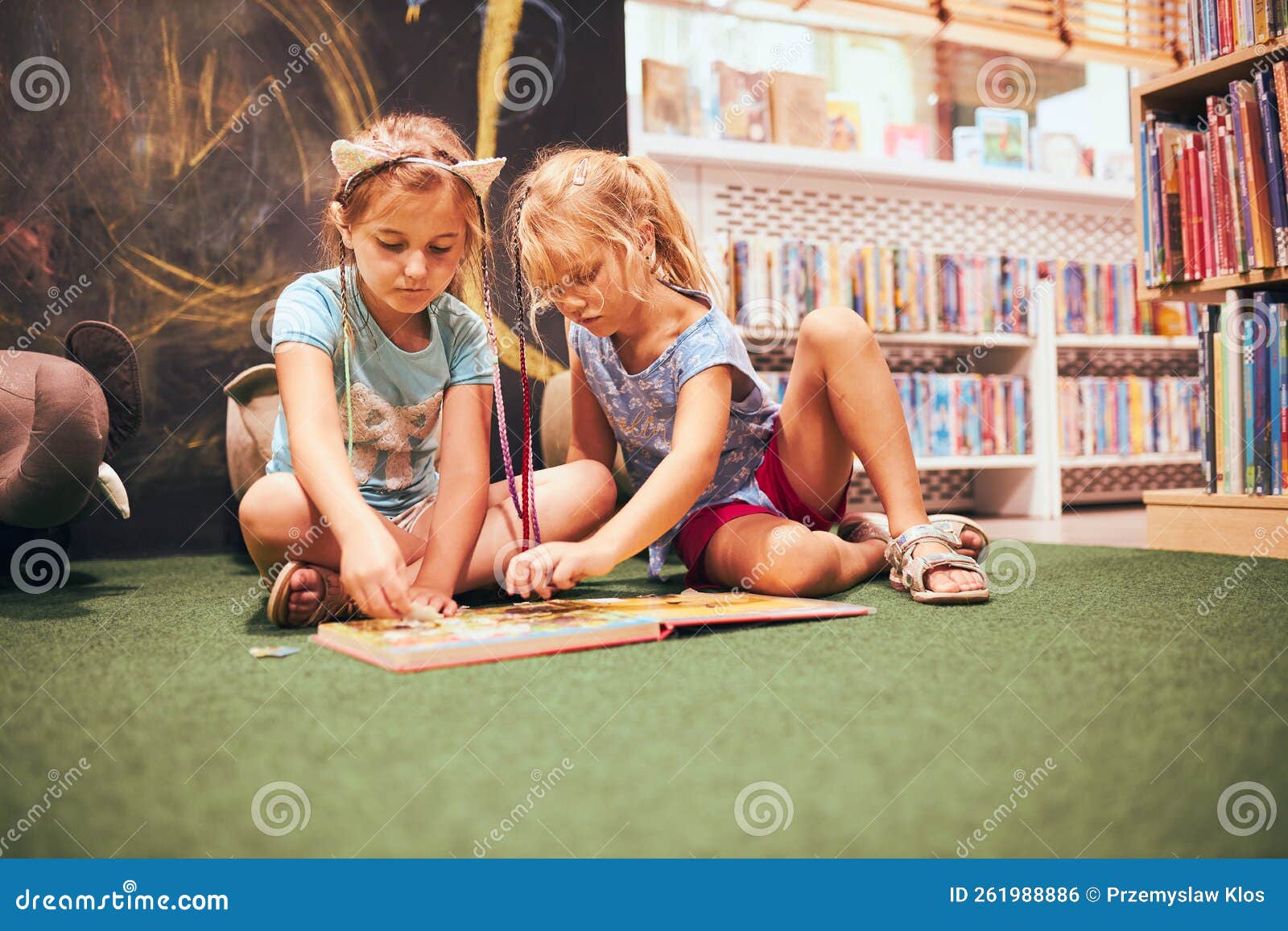 Two Elementary Schoolgirls Solving Puzzles and Riddles in School ...