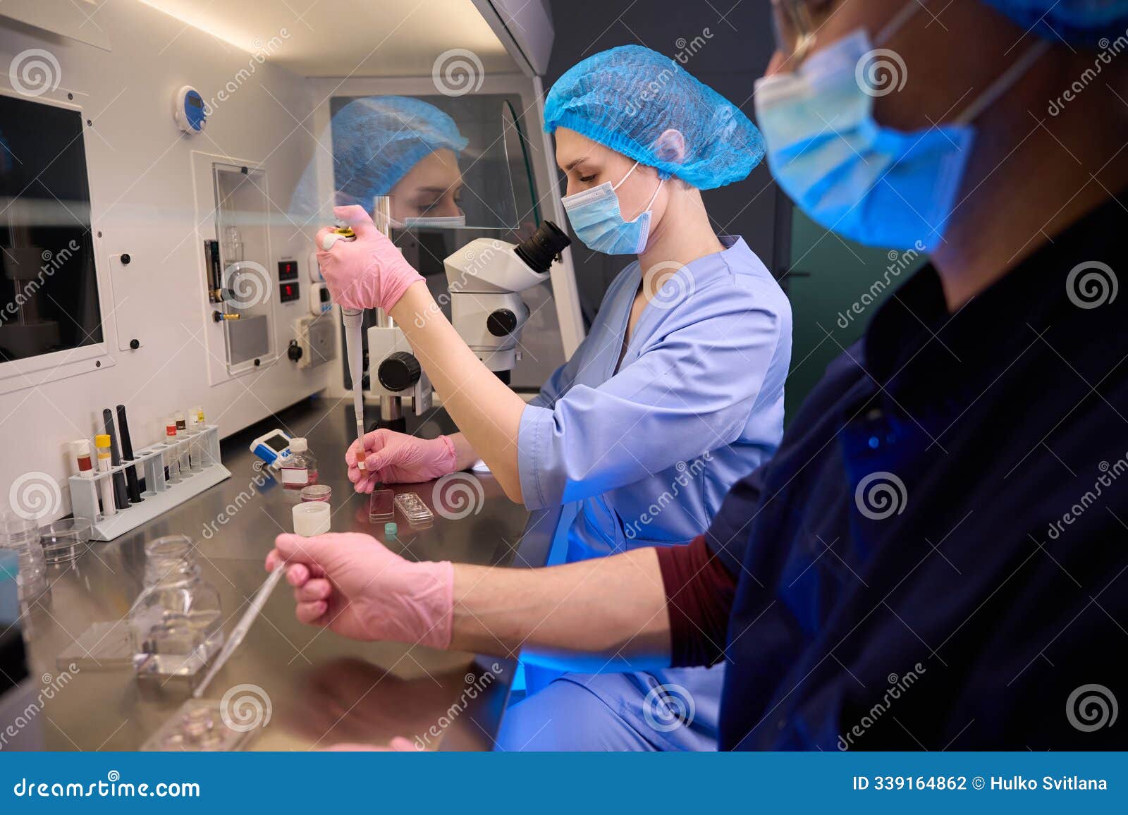 Adult Embryologists Coordinating Lab Work during a Delicate Procedure ...