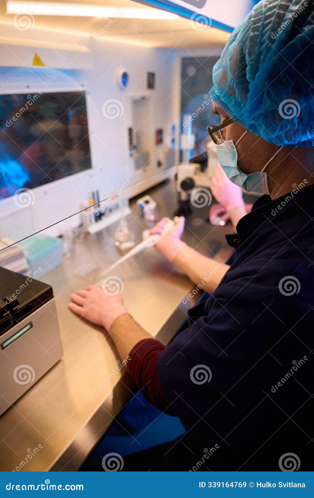 Embryologists Performing a Delicate Lab Task in Unison Stock Image ...