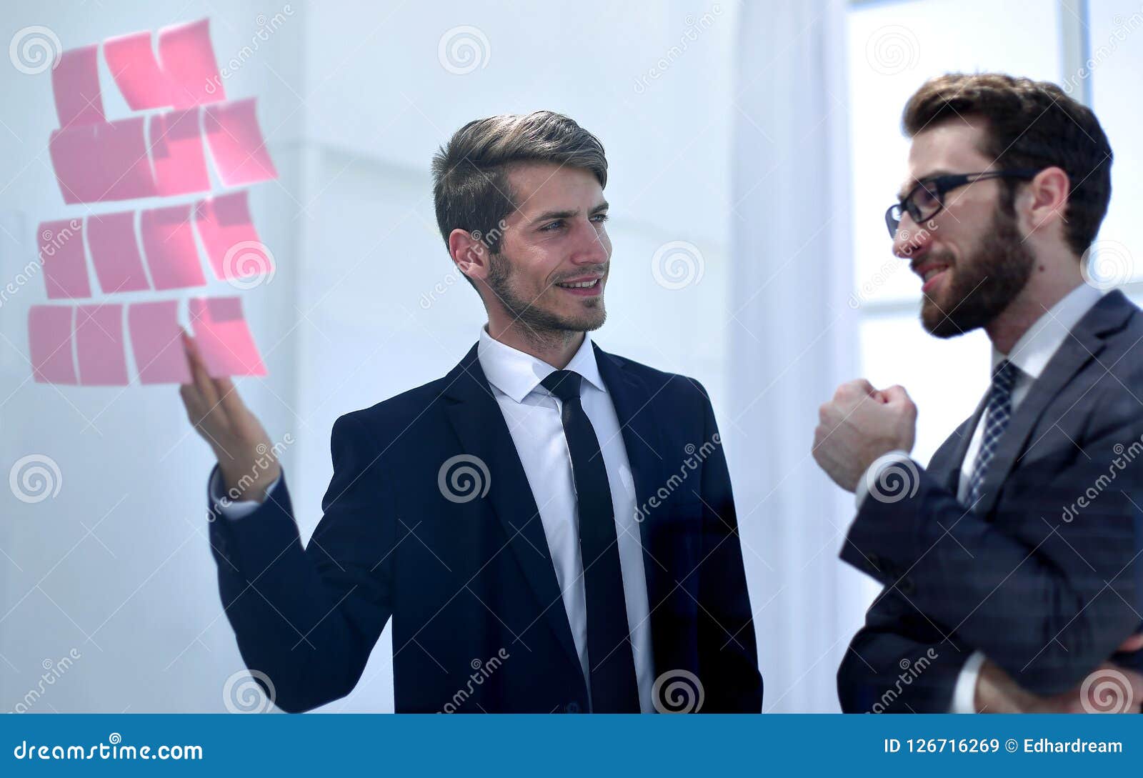 Two Employees Discuss the Business Objectives Stock Image - Image of ...