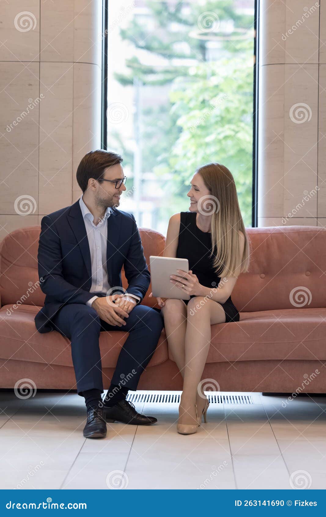 Two Employees Discussing on-line Presentation on Tablet Computer Stock ...