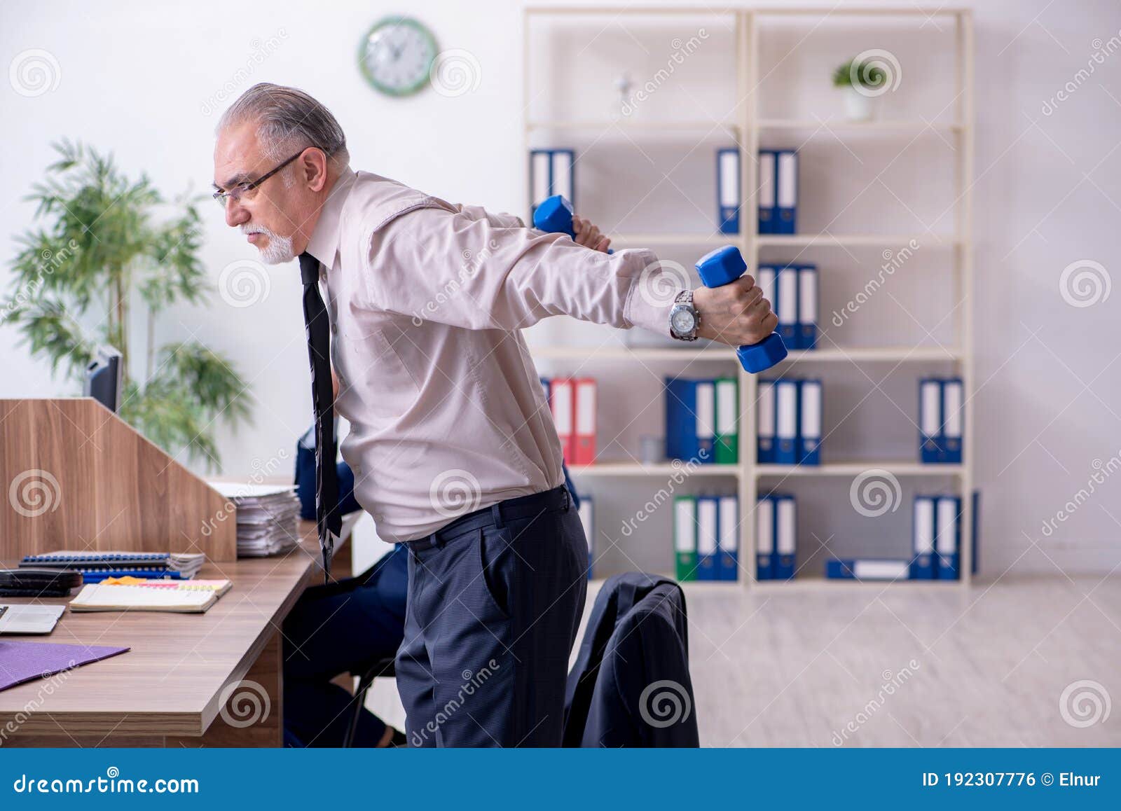Two Employees Doing Physical Exercises at Workplace Stock Photo - Image ...