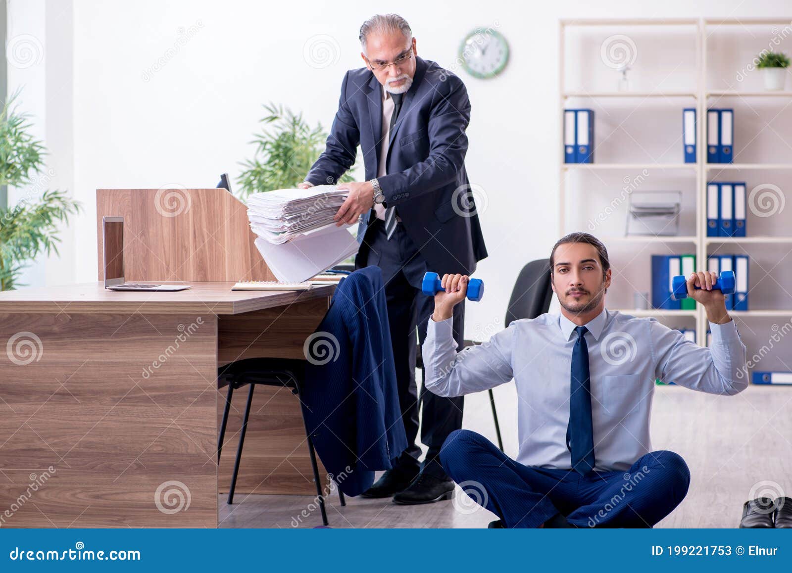Two Employees Doing Physical Exercises at Workplace Stock Image - Image ...