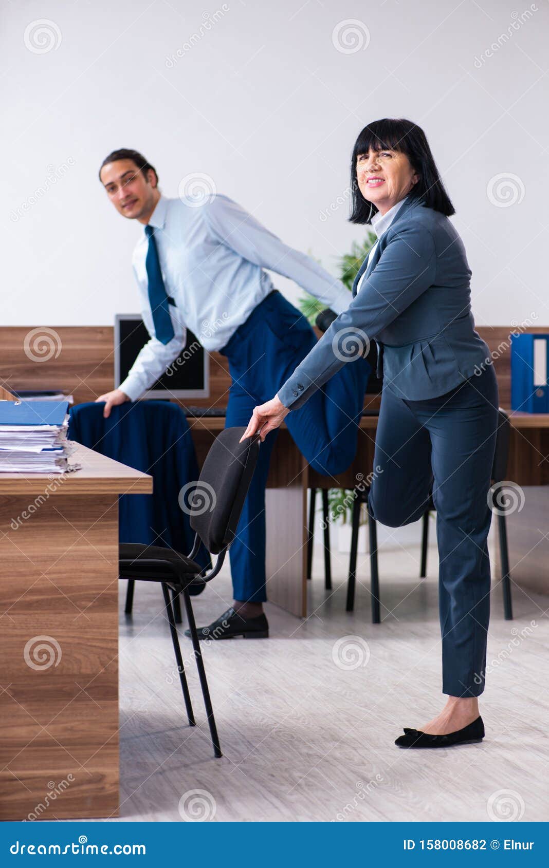 Two Employees Doing Sport Exercises in the Office Stock Photo - Image ...