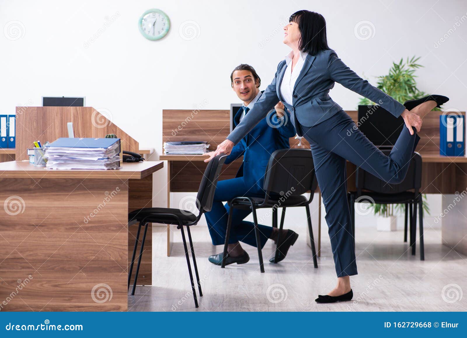 Two Employees Doing Sport Exercises in the Office Stock Photo - Image ...