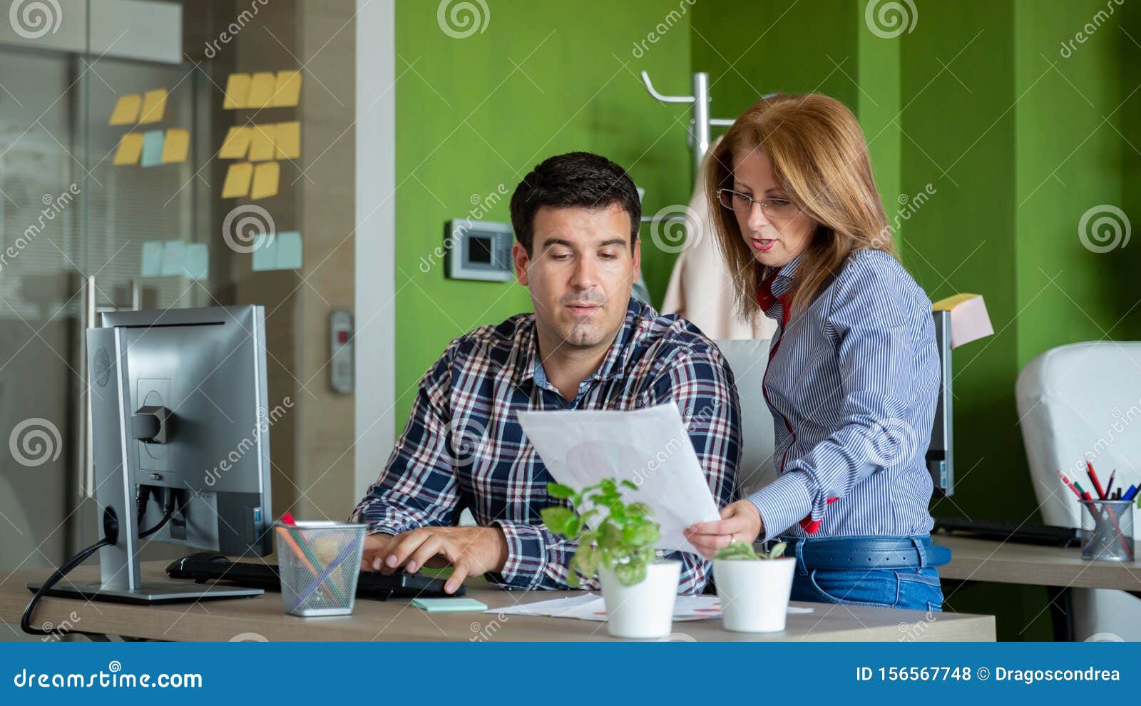 Two Employees are Looking at a Sheet Stock Photo - Image of explaining ...
