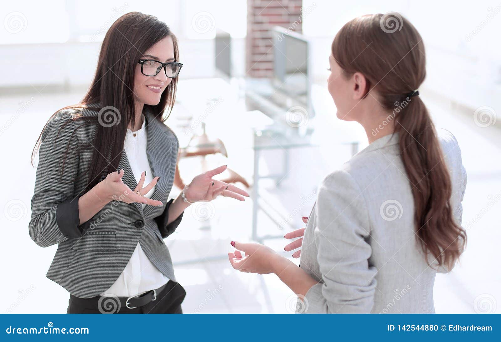 Two Employees Talking Standing in the Office Stock Photo - Image of ...
