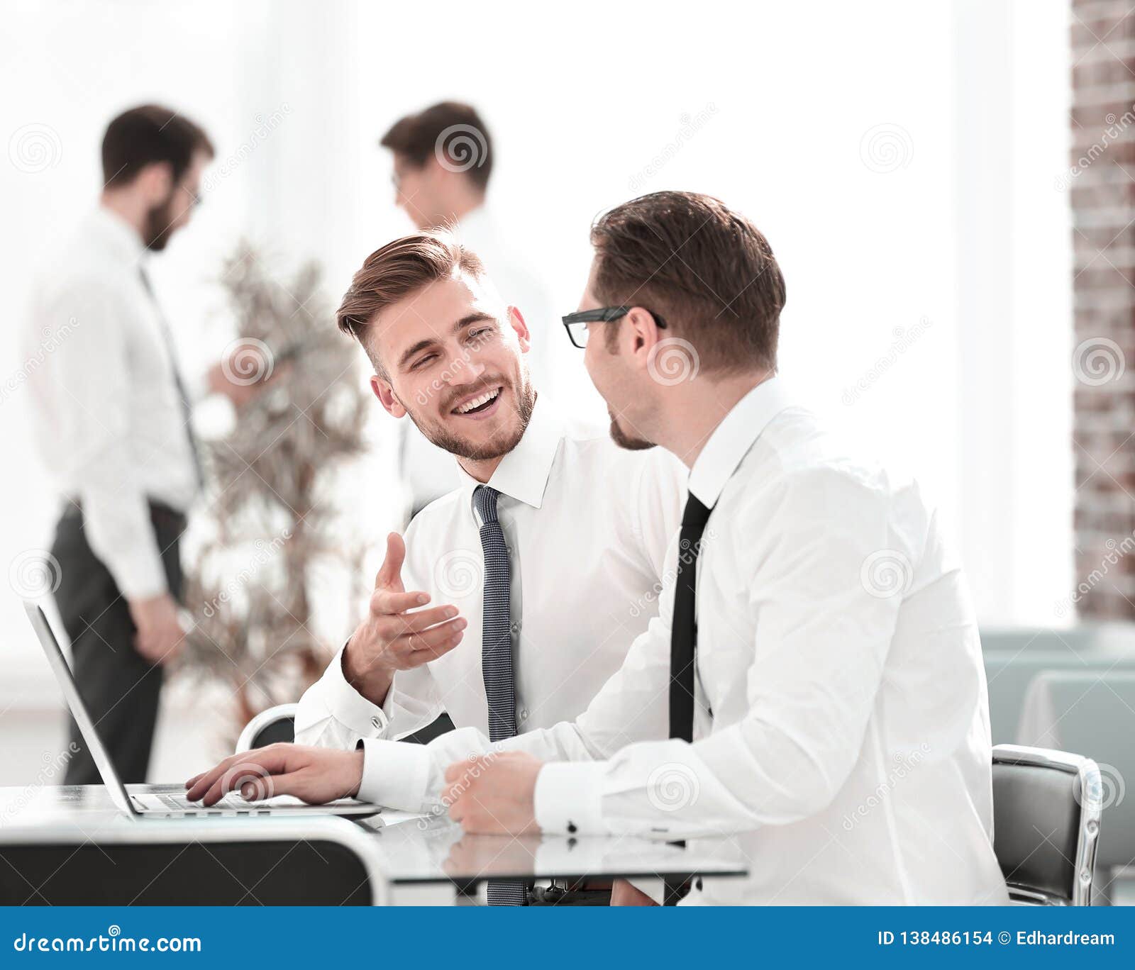 Two Employees Talking in the Workplace Stock Photo - Image of indoors ...