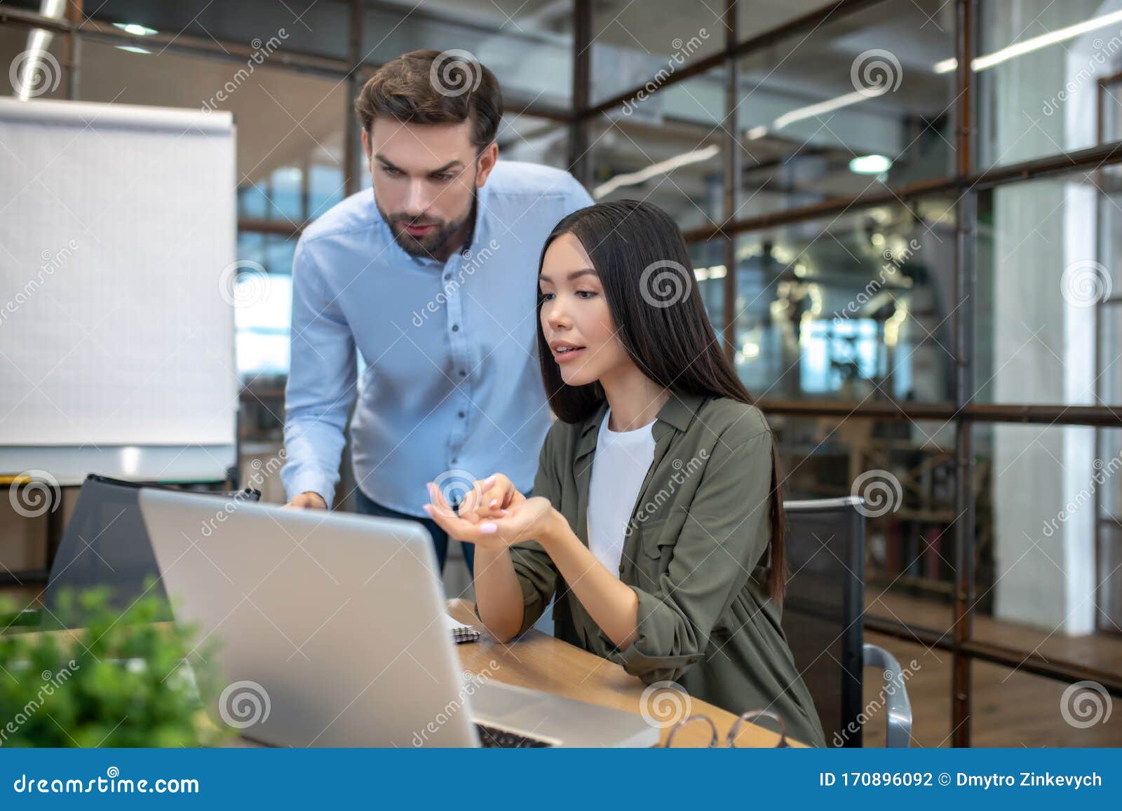 Two Employees Working in the Office and Looking Interested Stock Photo ...