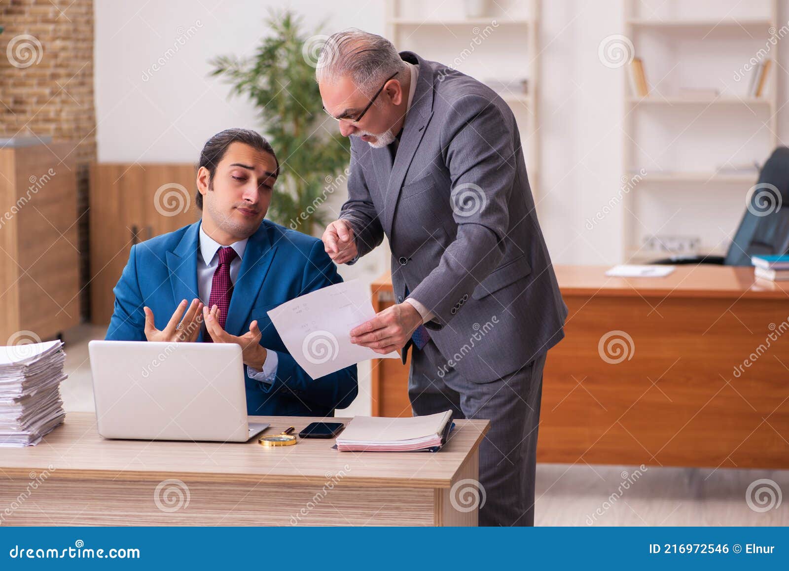 Two Employees Working in the Office Stock Photo - Image of document ...
