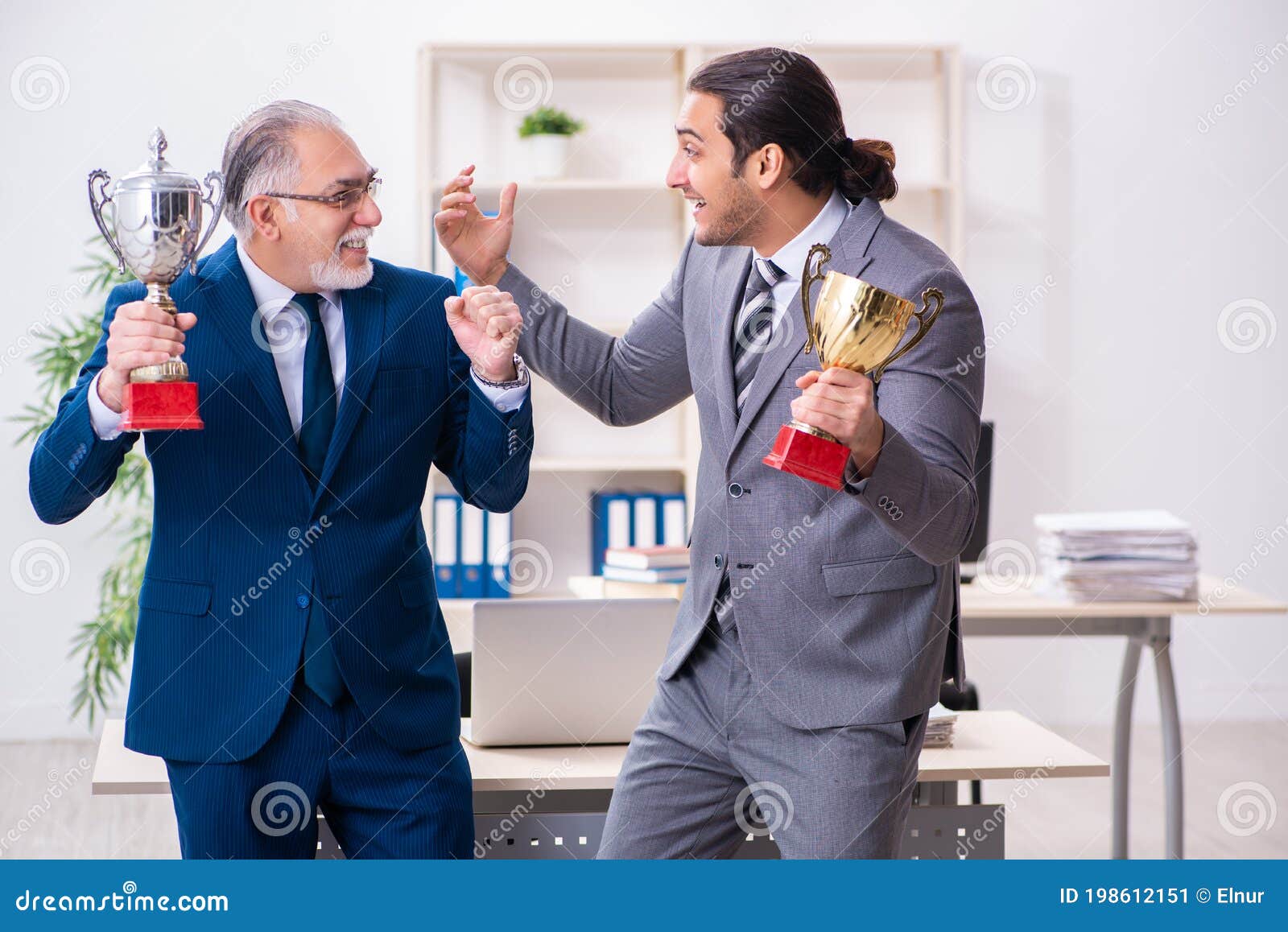 Two Male Employees Working in the Office Stock Image - Image of holding ...
