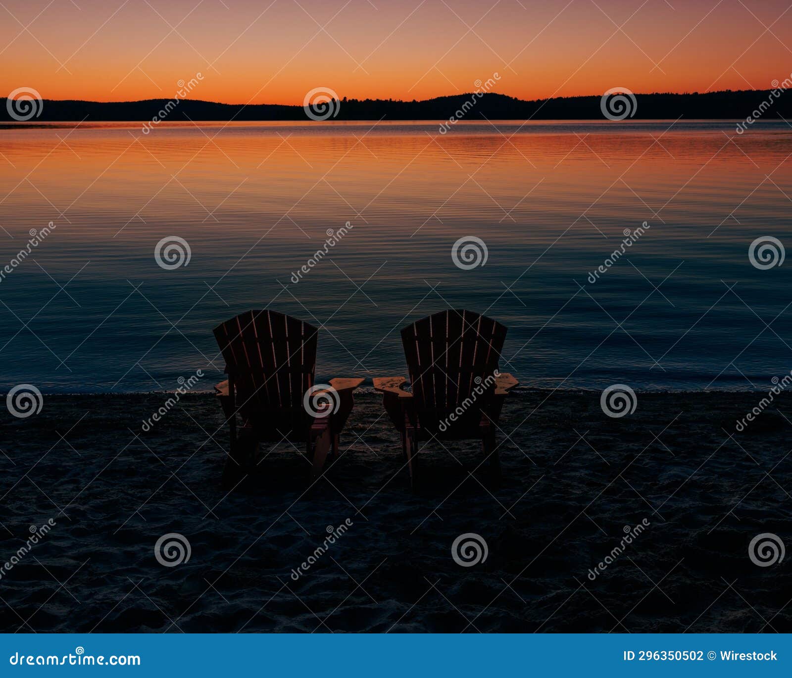 Two Empty Chairs Sit at a Beach in Front of the Ocean Stock Photo ...