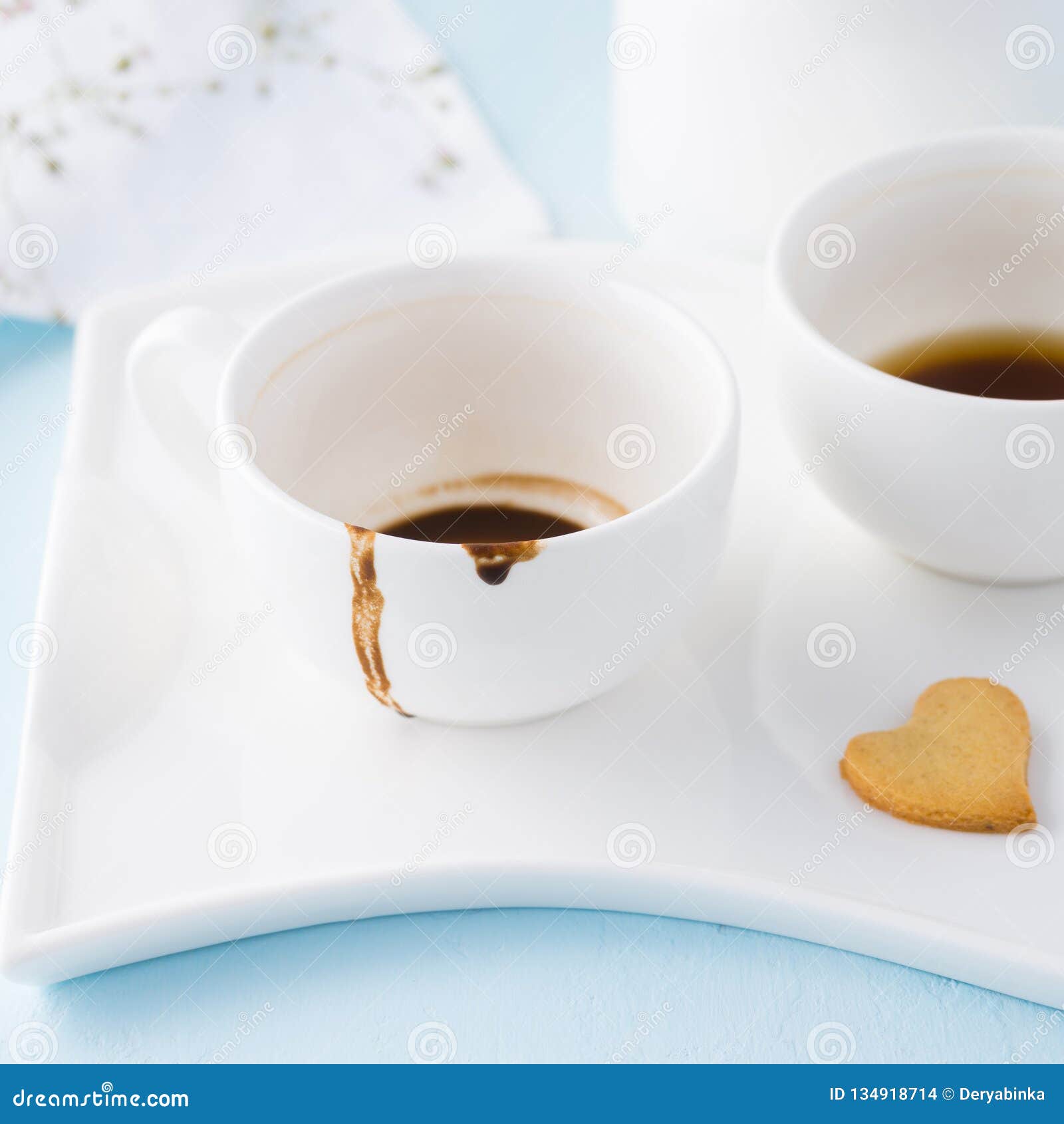 Two Empty Cups of Coffee and Heart Shaped Cookie on a Tray. Stock Photo ...
